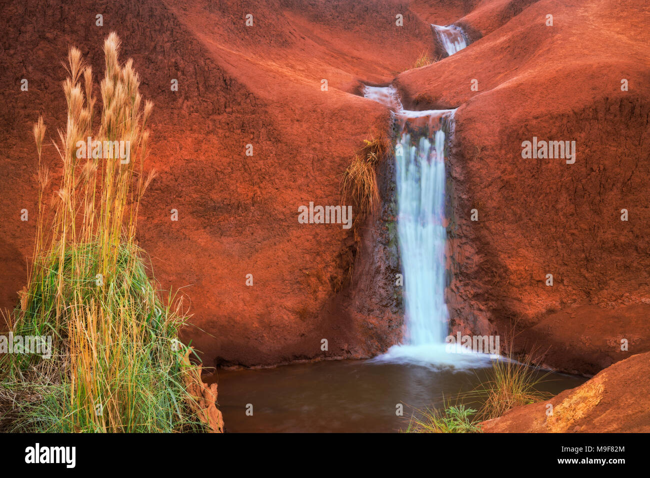 Red Falls pours over the volcanic soil near the Waimea Canyon Drive on ...
