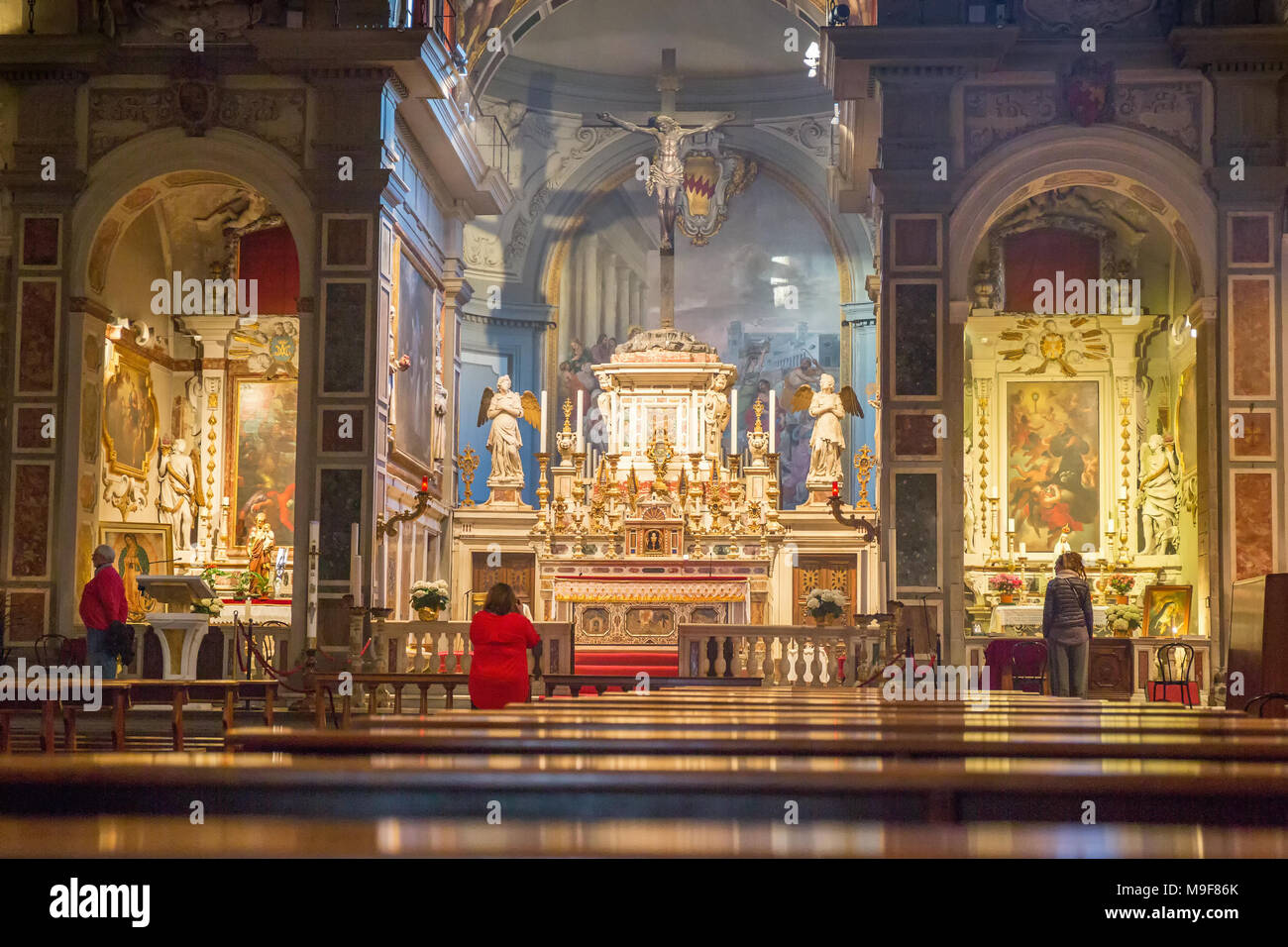 Visitors looking at the church's interior Chiesa di Ognissanti in ...