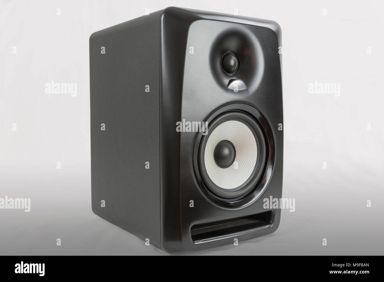 single black professional sound studio monitor on white background ...
