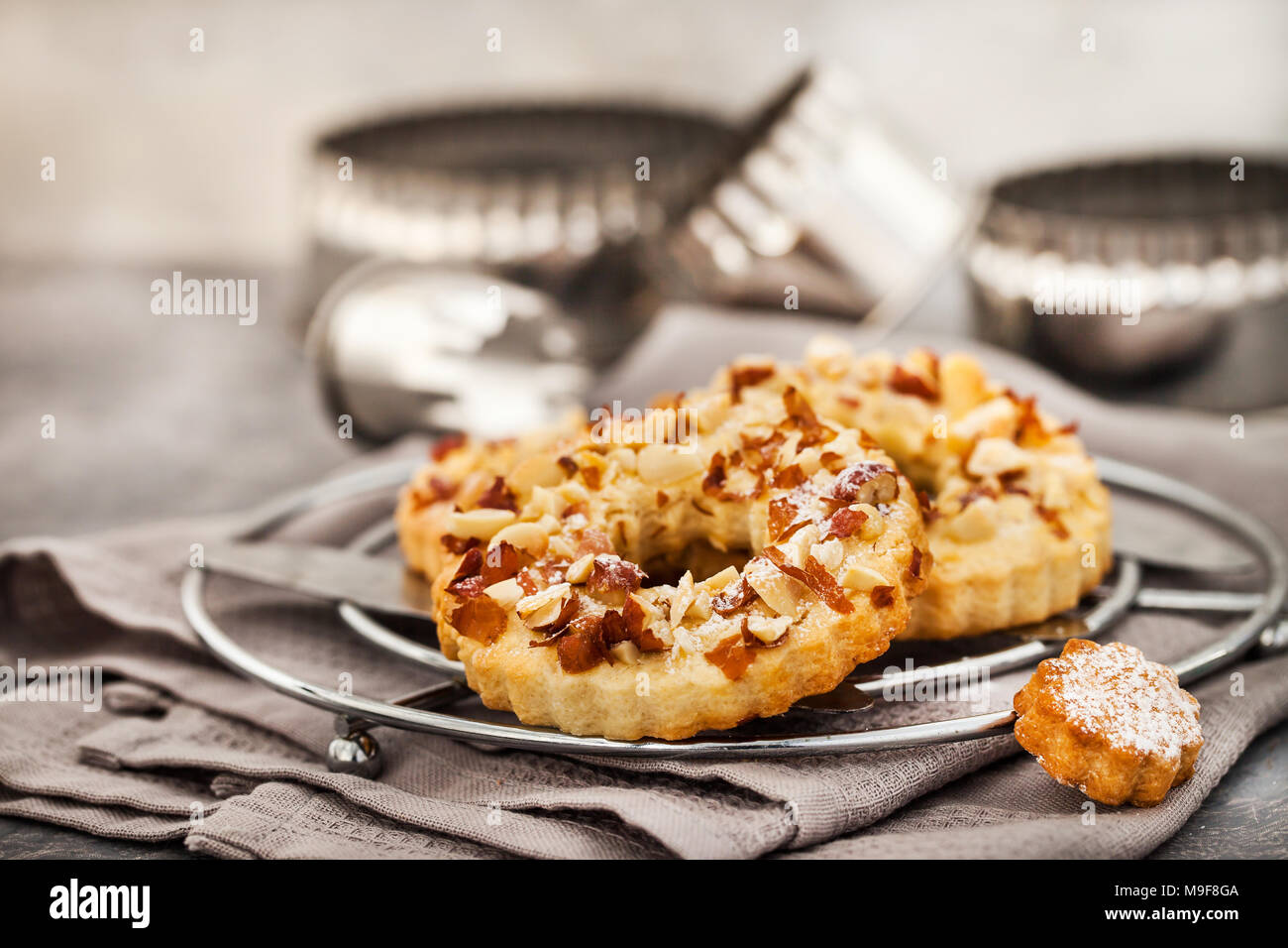 Ring shortbread cookies with peanuts on top Stock Photo - Alamy