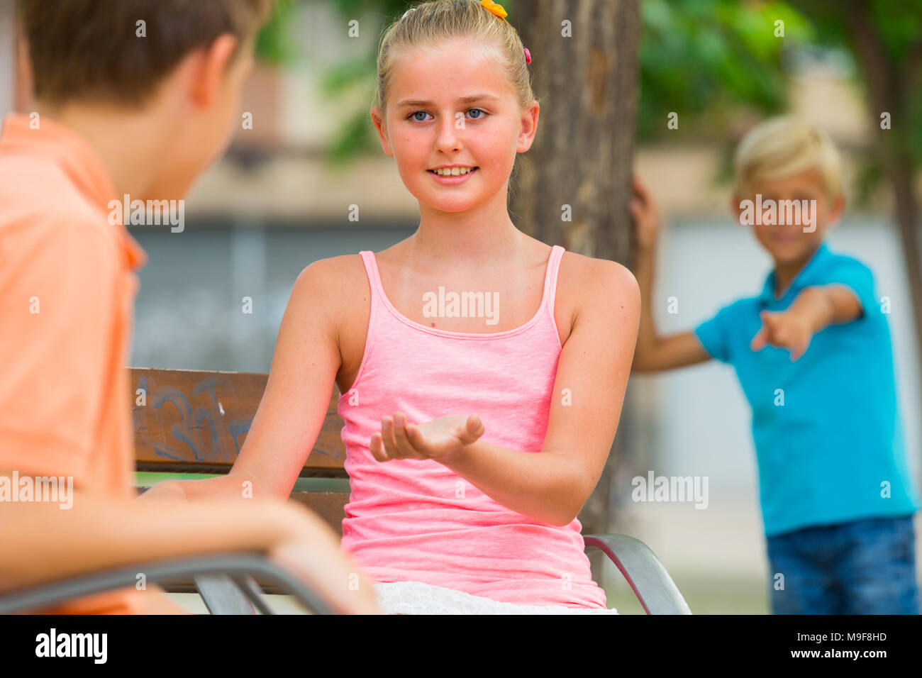 Older girl talking to younger friend hi-res stock photography and ...