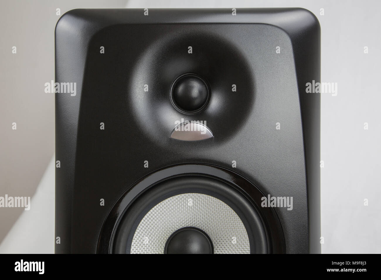single black professional sound studio monitor on white background ...