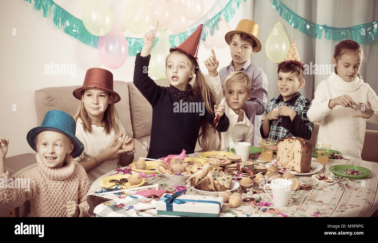 Smiling children having fun during friend’s birthday party Stock Photo ...
