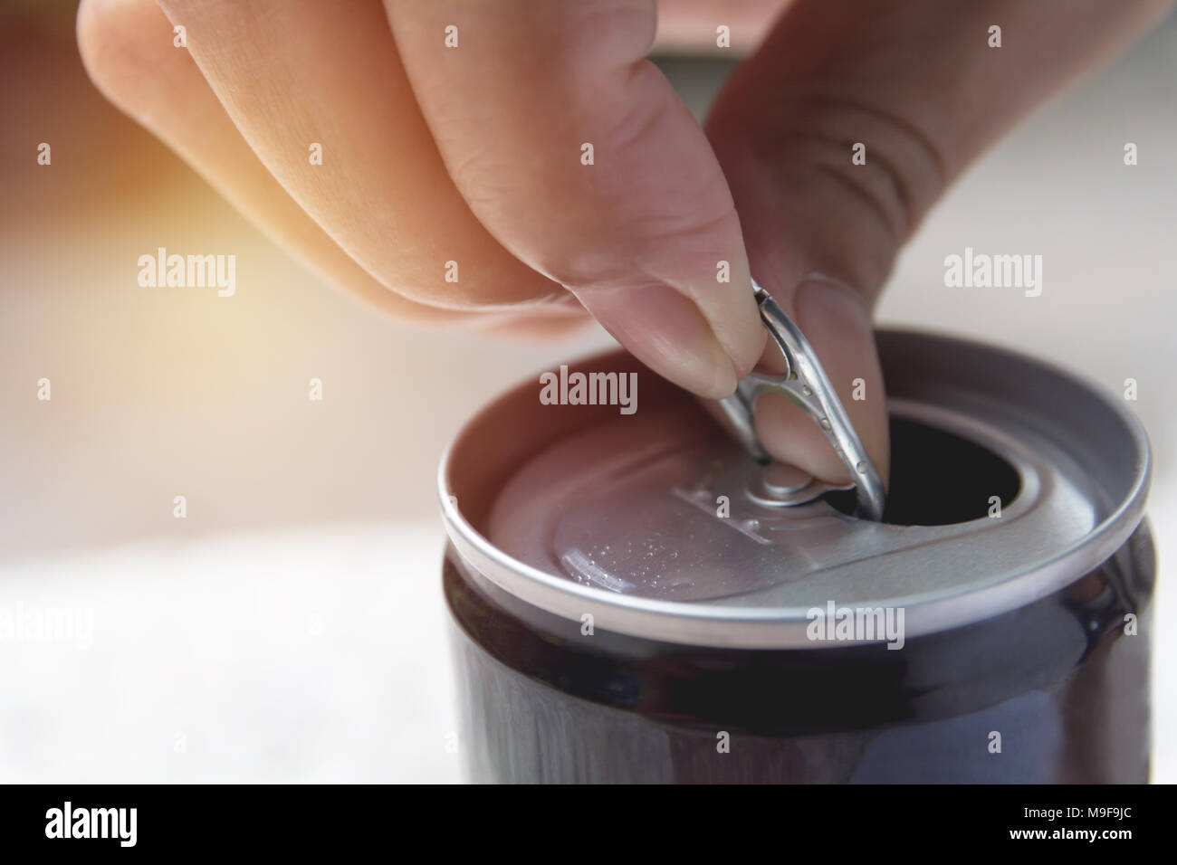 Empty aluminum can hand hi-res stock photography and images - Alamy