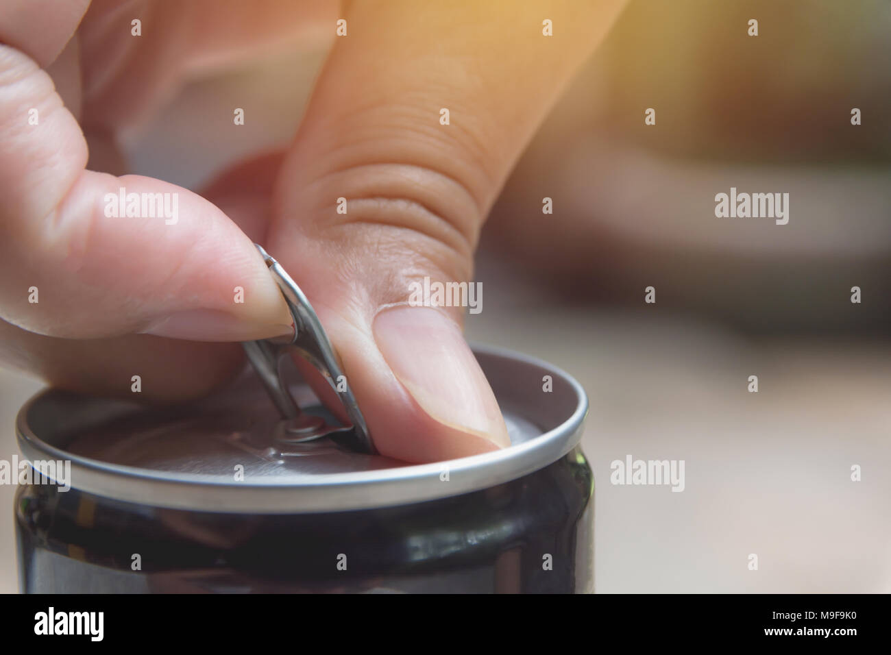 Empty aluminum can hand hi-res stock photography and images - Alamy