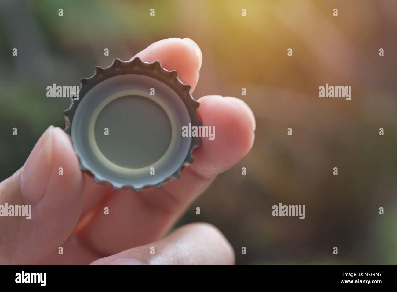 Hand holding bottle top hi-res stock photography and images - Alamy