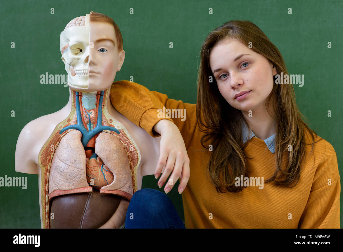 Cool female high school student portrait with an artificial human body ...
