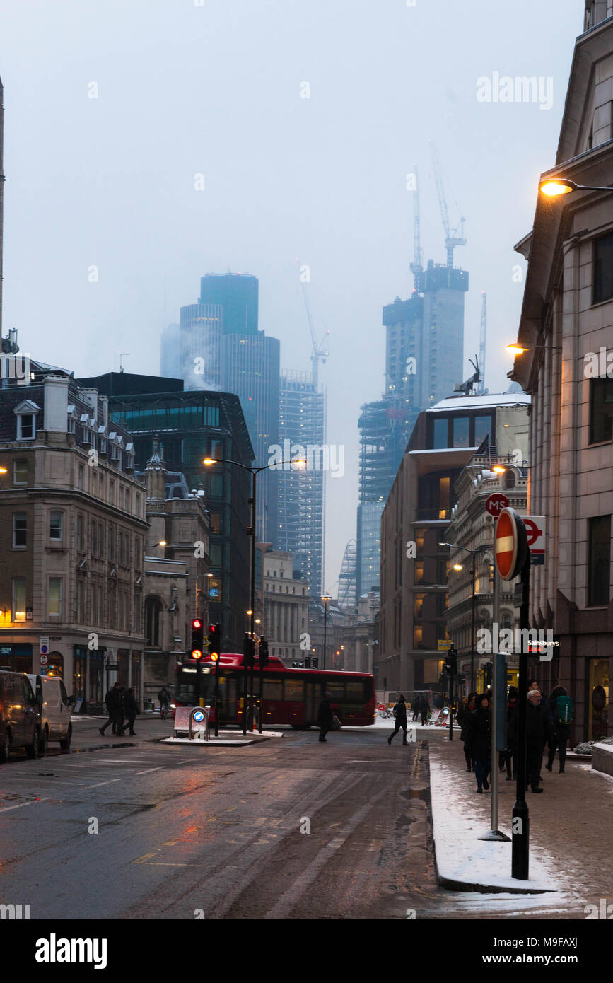 Queen Victoria Street on a snowy winter morning, London, England, UK ...