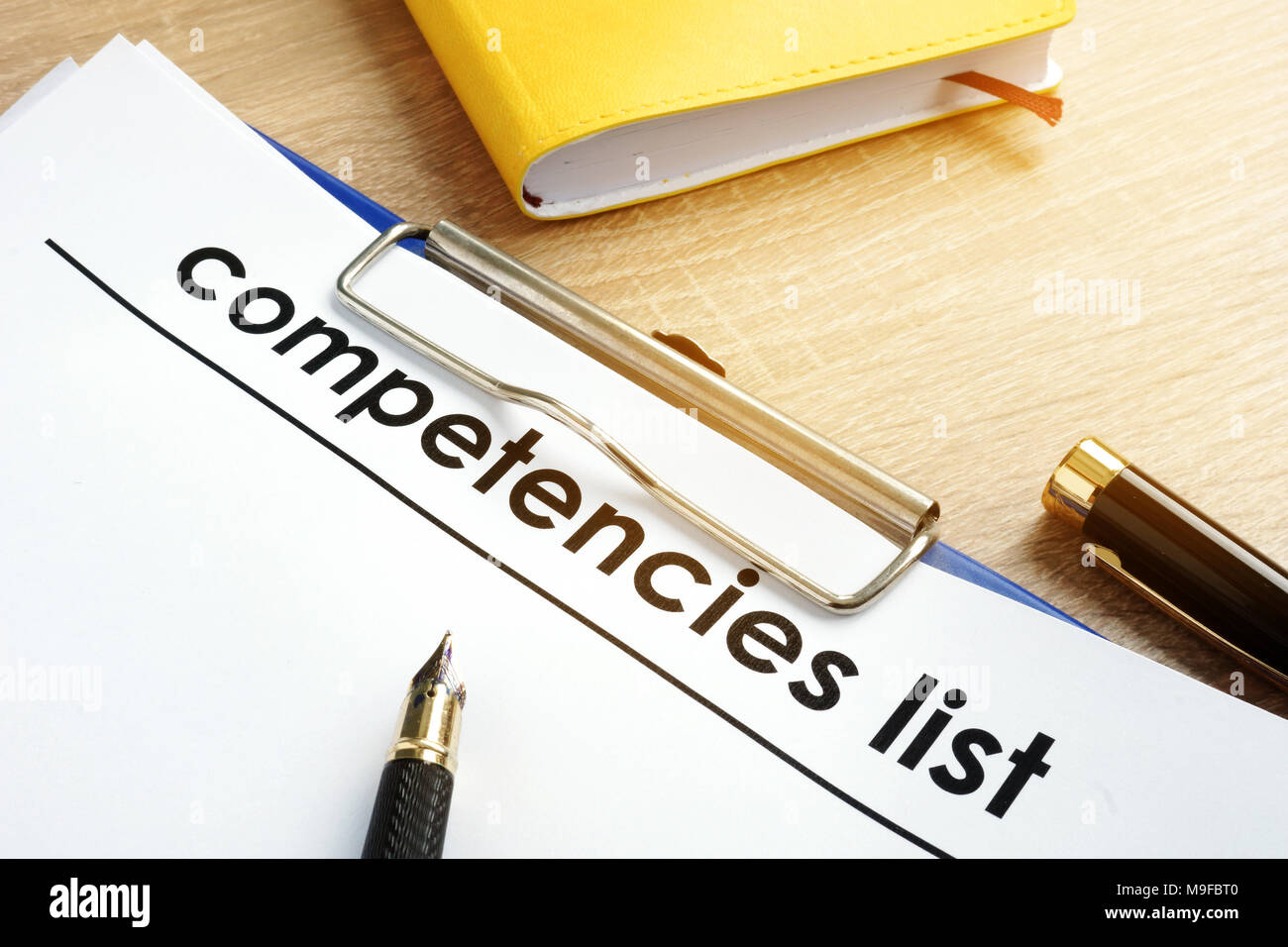 Competencies list with clipboard on a table Stock Photo - Alamy
