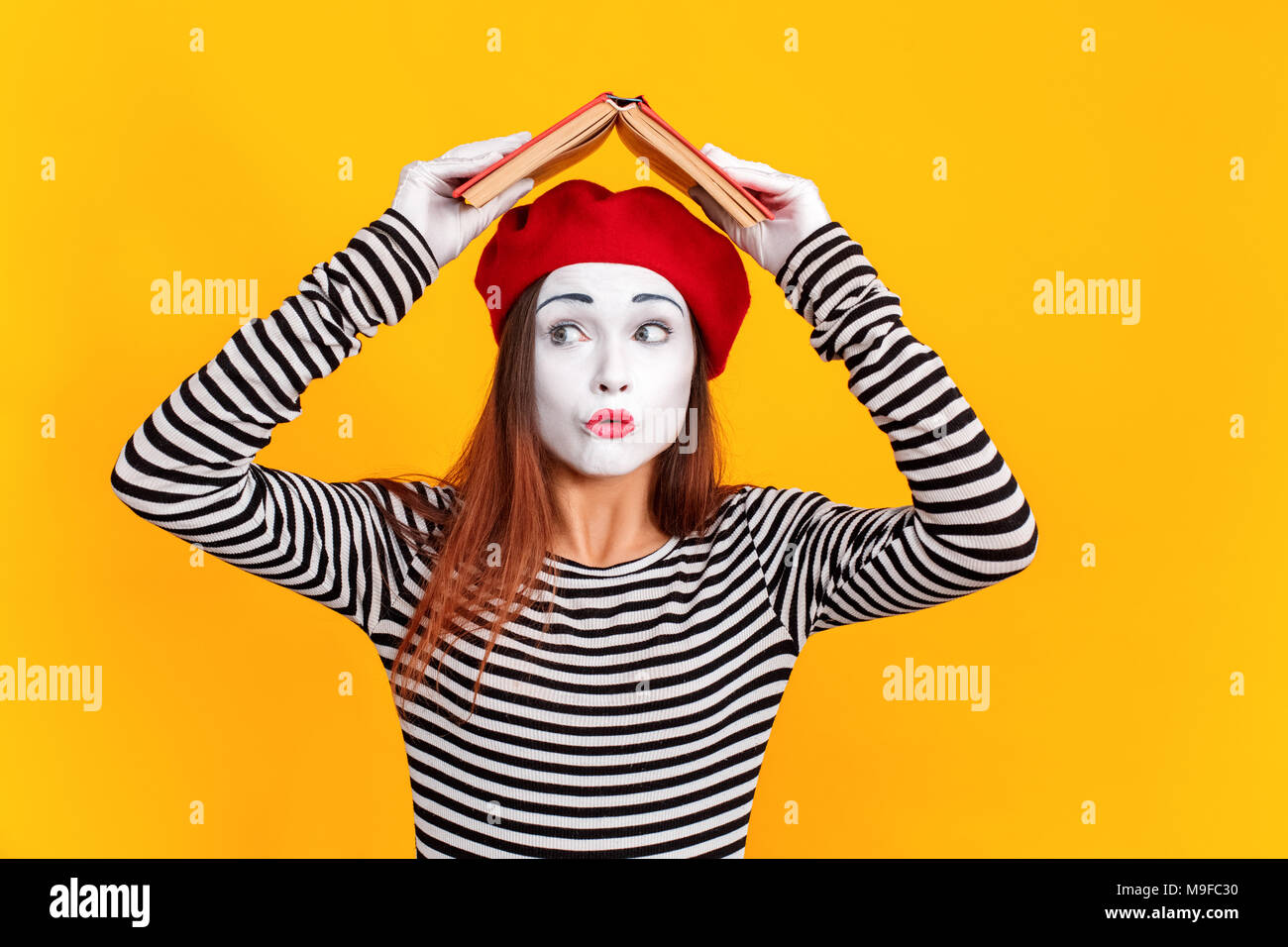 Portrait of cute mime woman at home, roof sign. Emotions and feelings ...