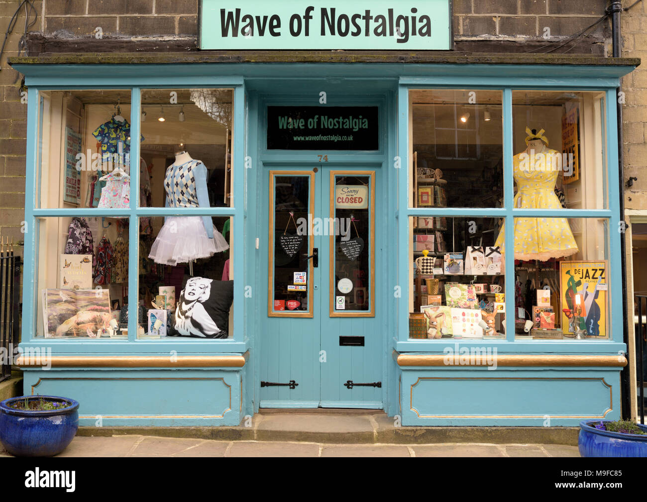 Light blue painted clothing shop front, wave of nostalgia, on the main ...