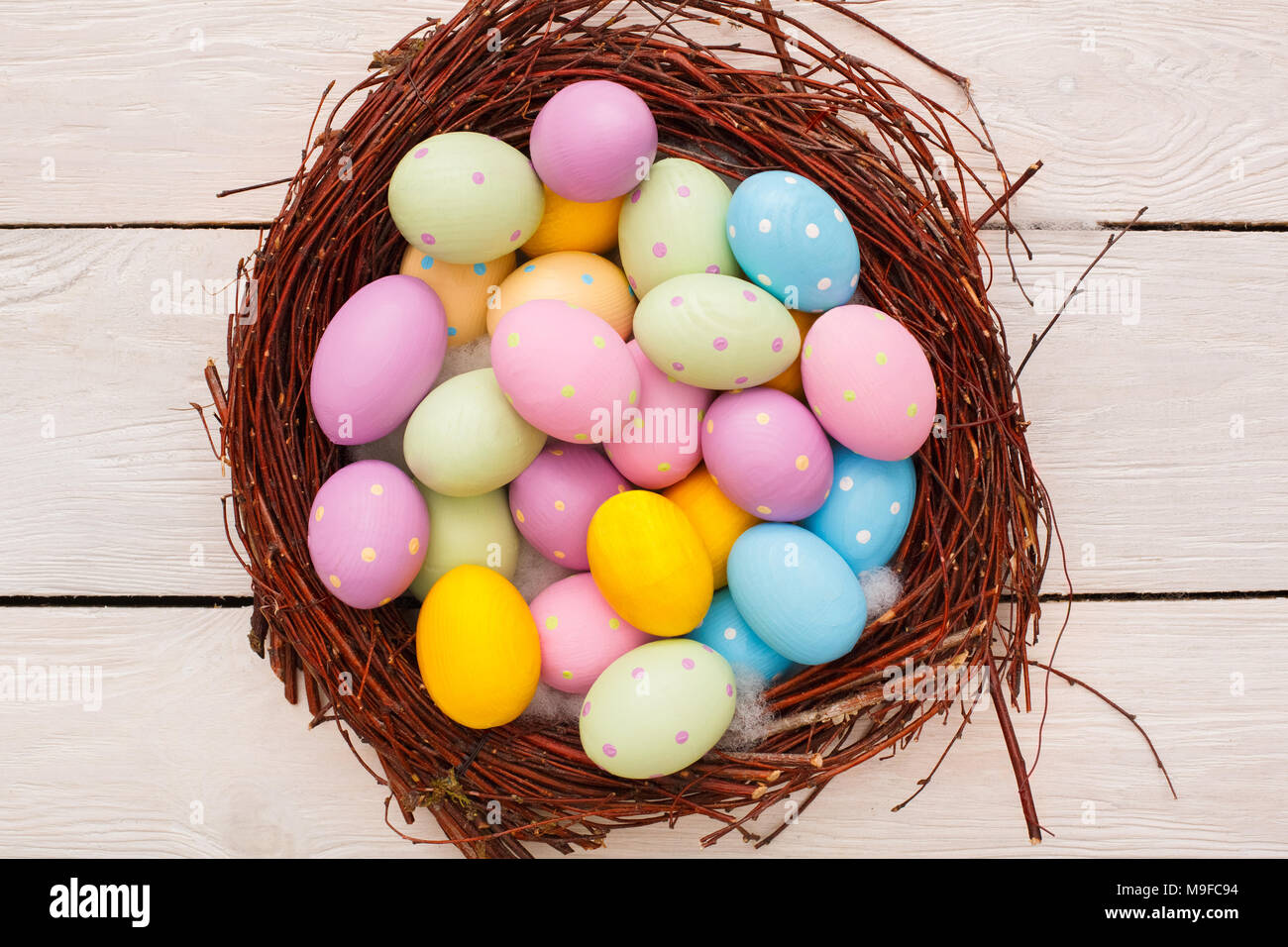 Easter objects colorful eggs colored in dots isolated on wooden ...
