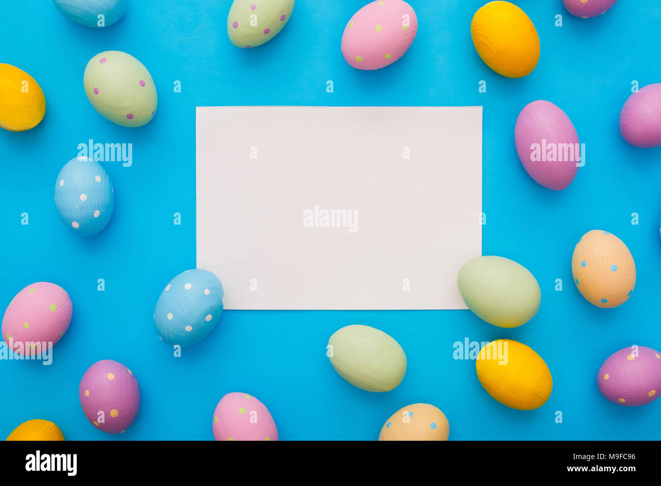 Easter traditional objects isolated on blue background white sheet of ...