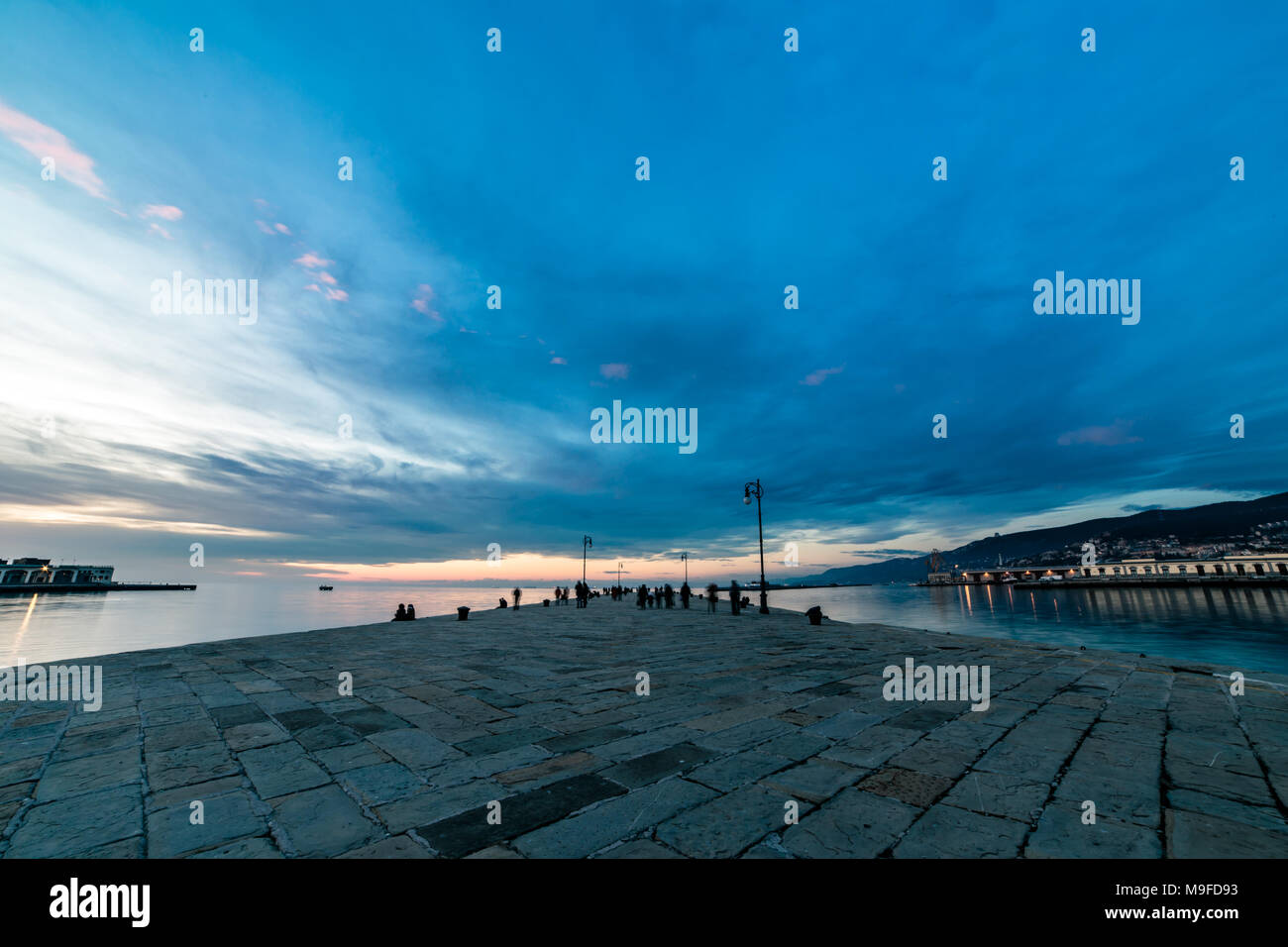 The Molo Audace pier of Trieste in a winter evening Stock Photo - Alamy