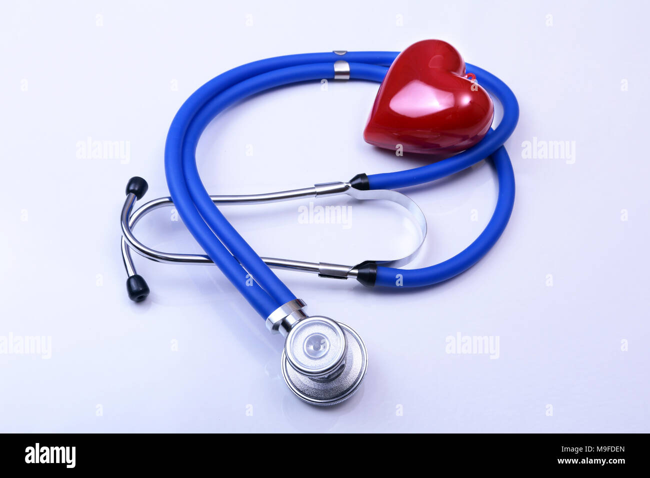Red heart and a stethoscope isolated on white background Stock Photo ...