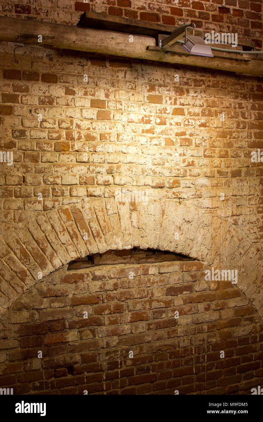 ancient brick arch on the wall by a lamp Stock Photo - Alamy