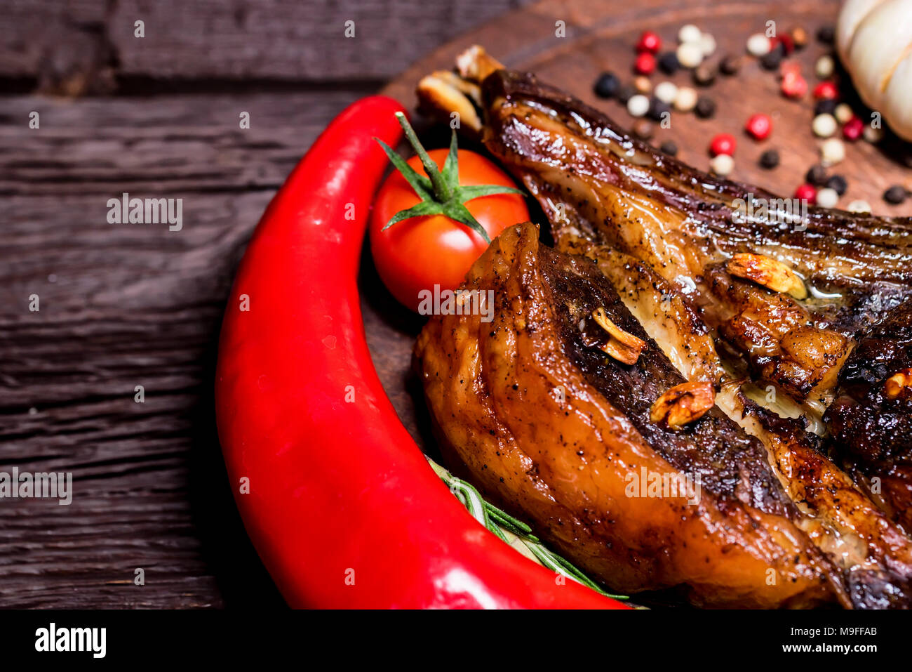 Tasty beef steak with spices and vegetables close Stock Photo - Alamy