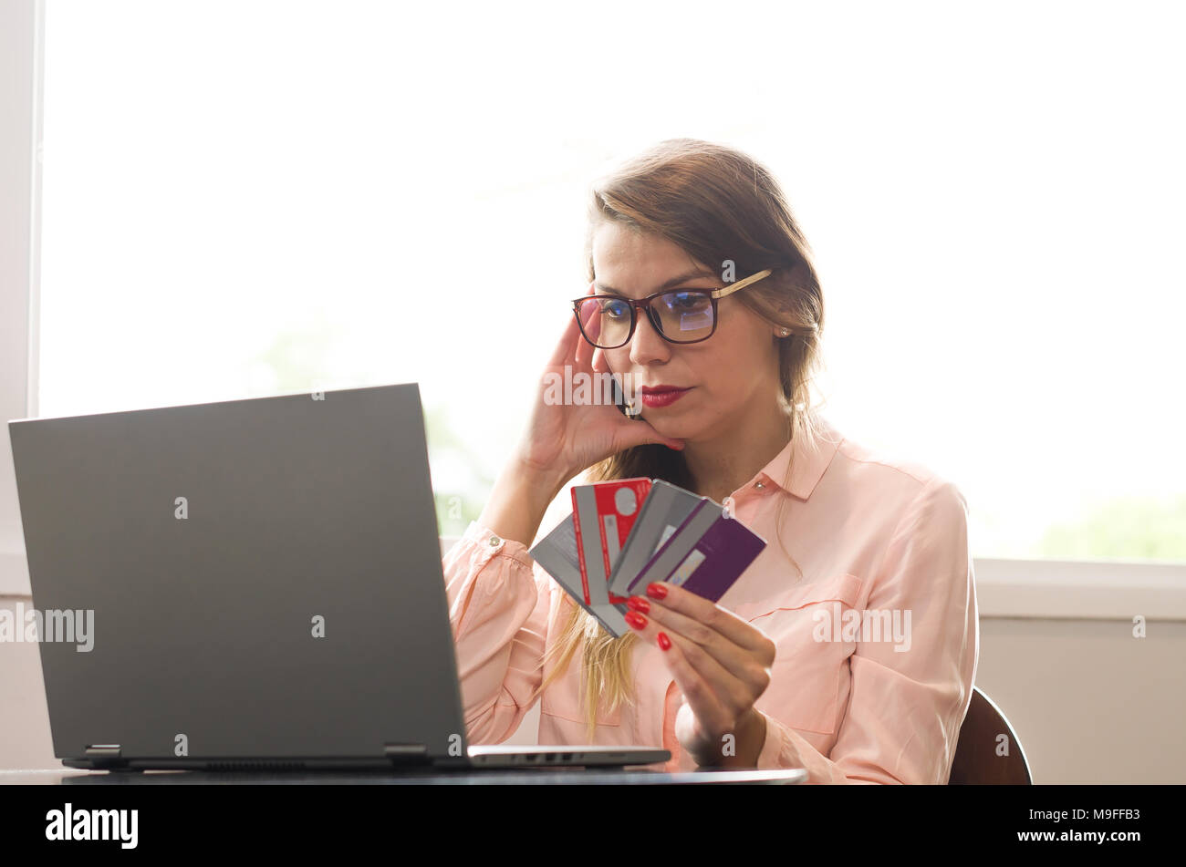 Woman worried bill in hand hi-res stock photography and images - Alamy