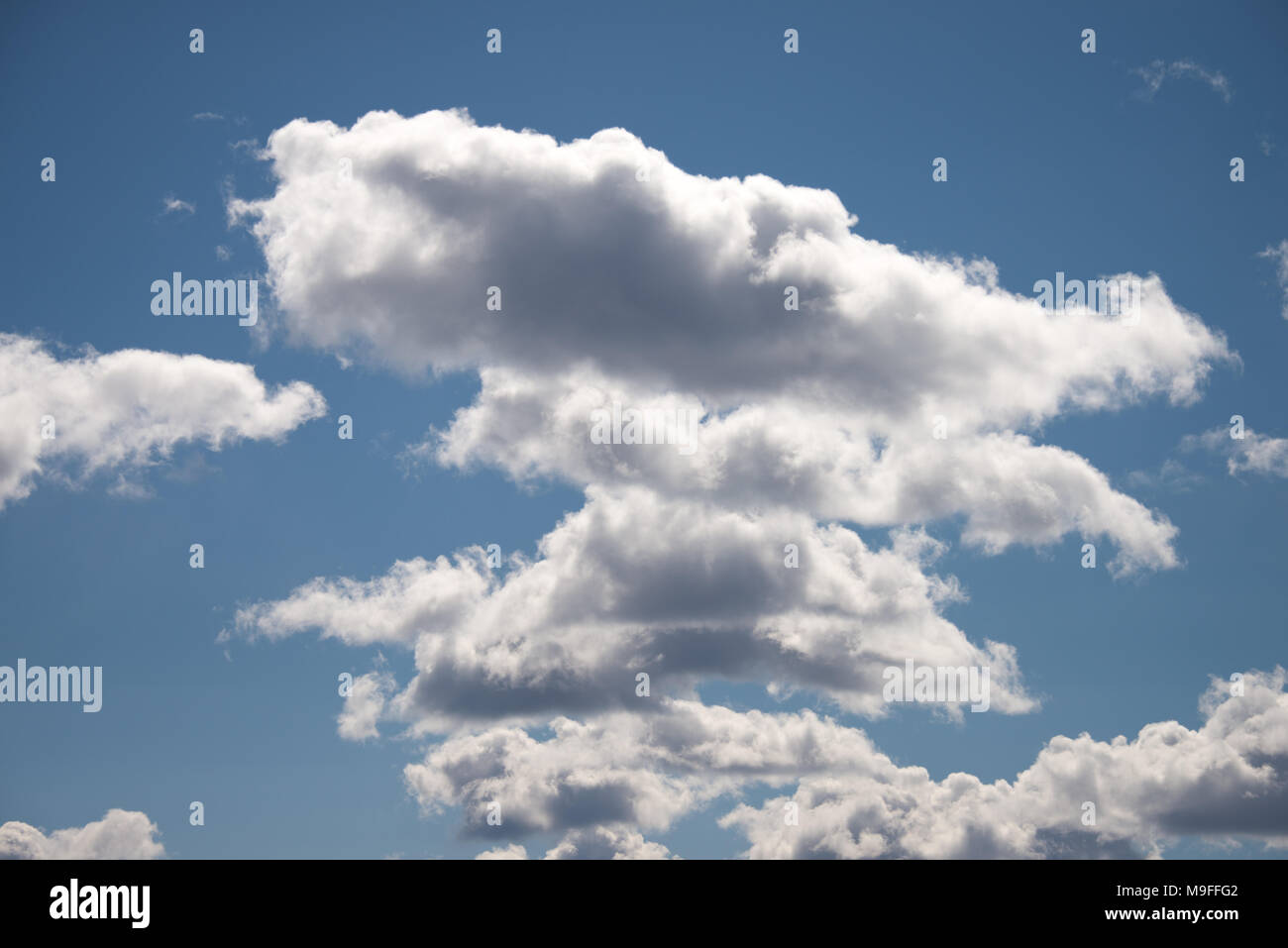 A deep blue sky with white cumulus clouds over Lake Pleasant in the ...