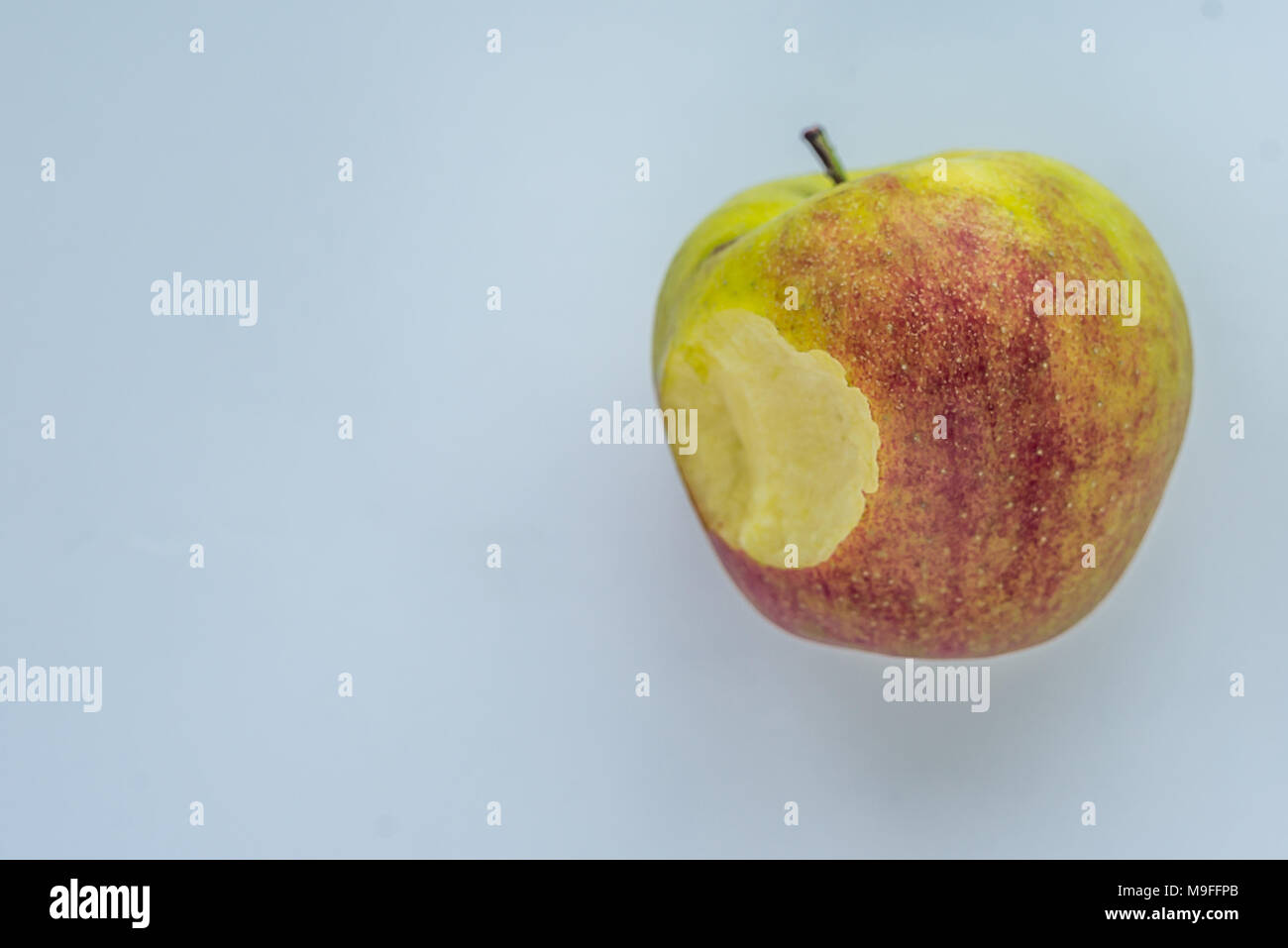 the bitten Apple on the background of the substrate for cards Stock ...