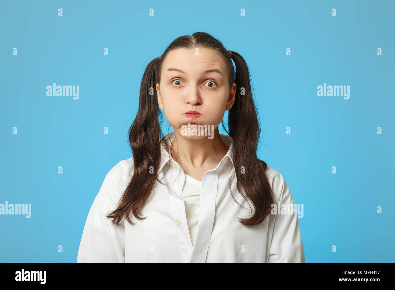 Cheeks puff hi-res stock photography and images - Alamy