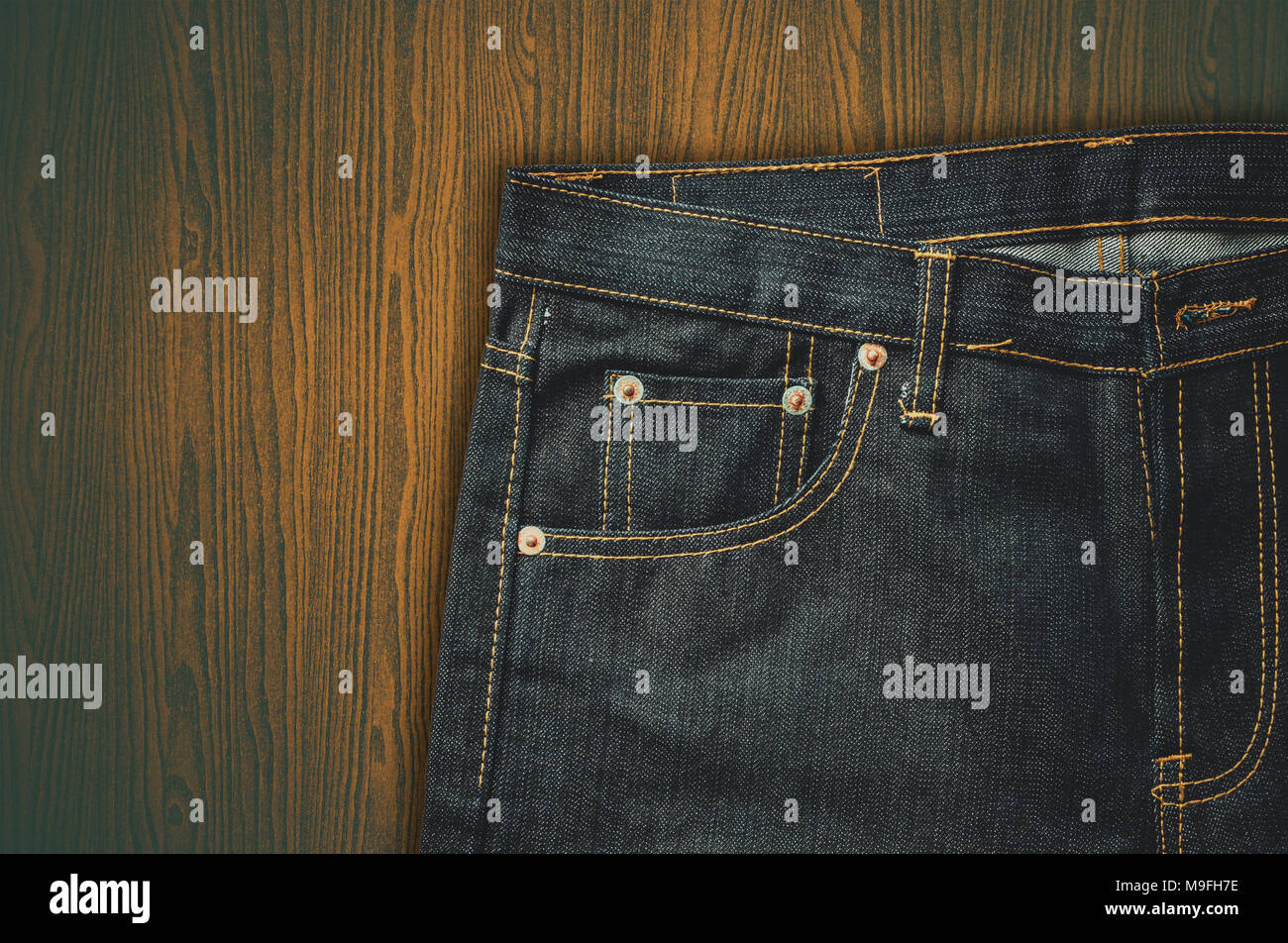 Folded denim on floor hi-res stock photography and images - Alamy