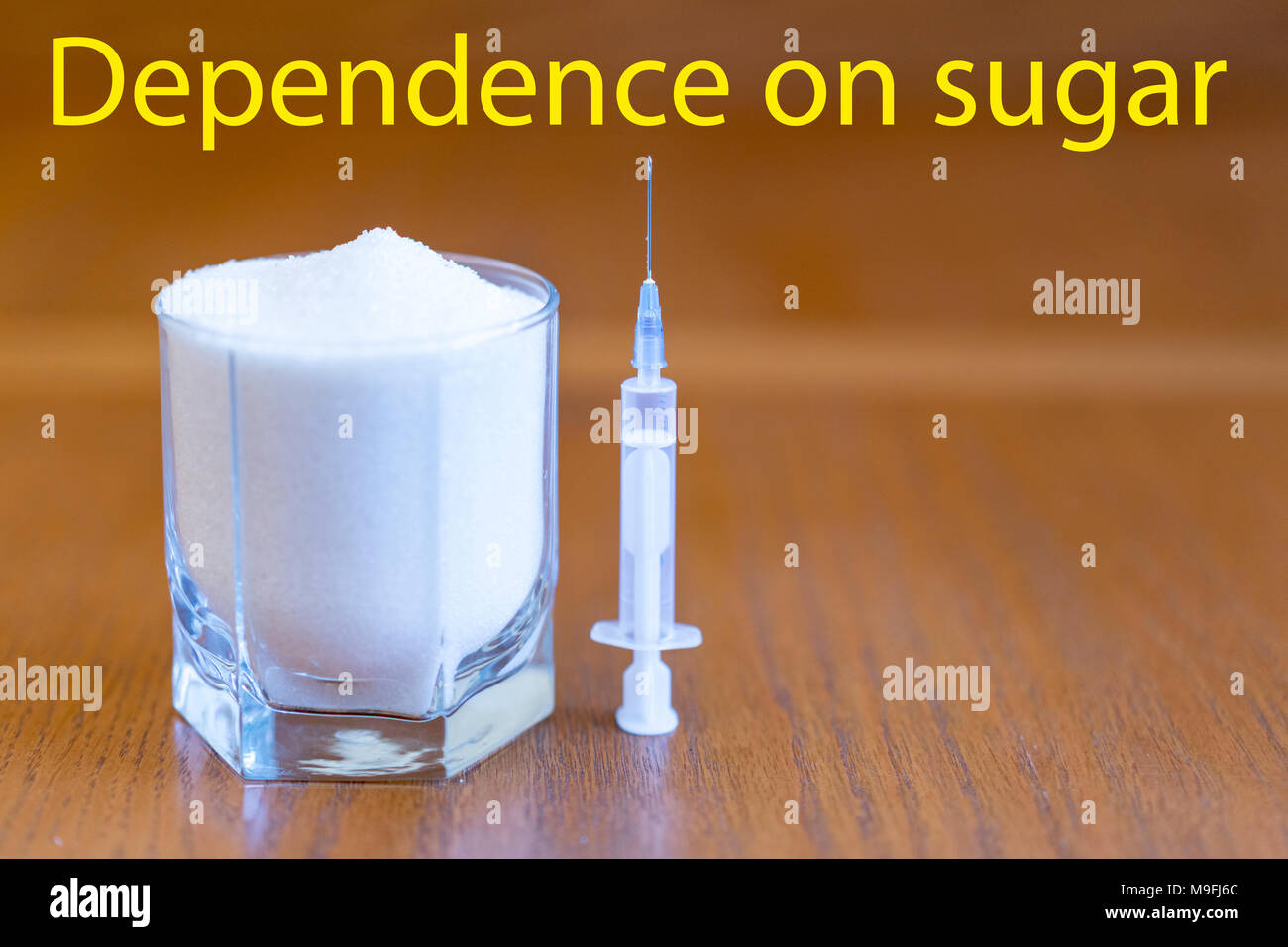 Sugar and syringe. the concept of dependence on the sweet. sugar is ...