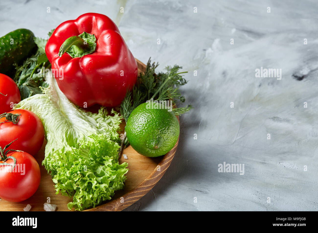 Colorful still life of fresh organic fruits and vegetables on wooden ...