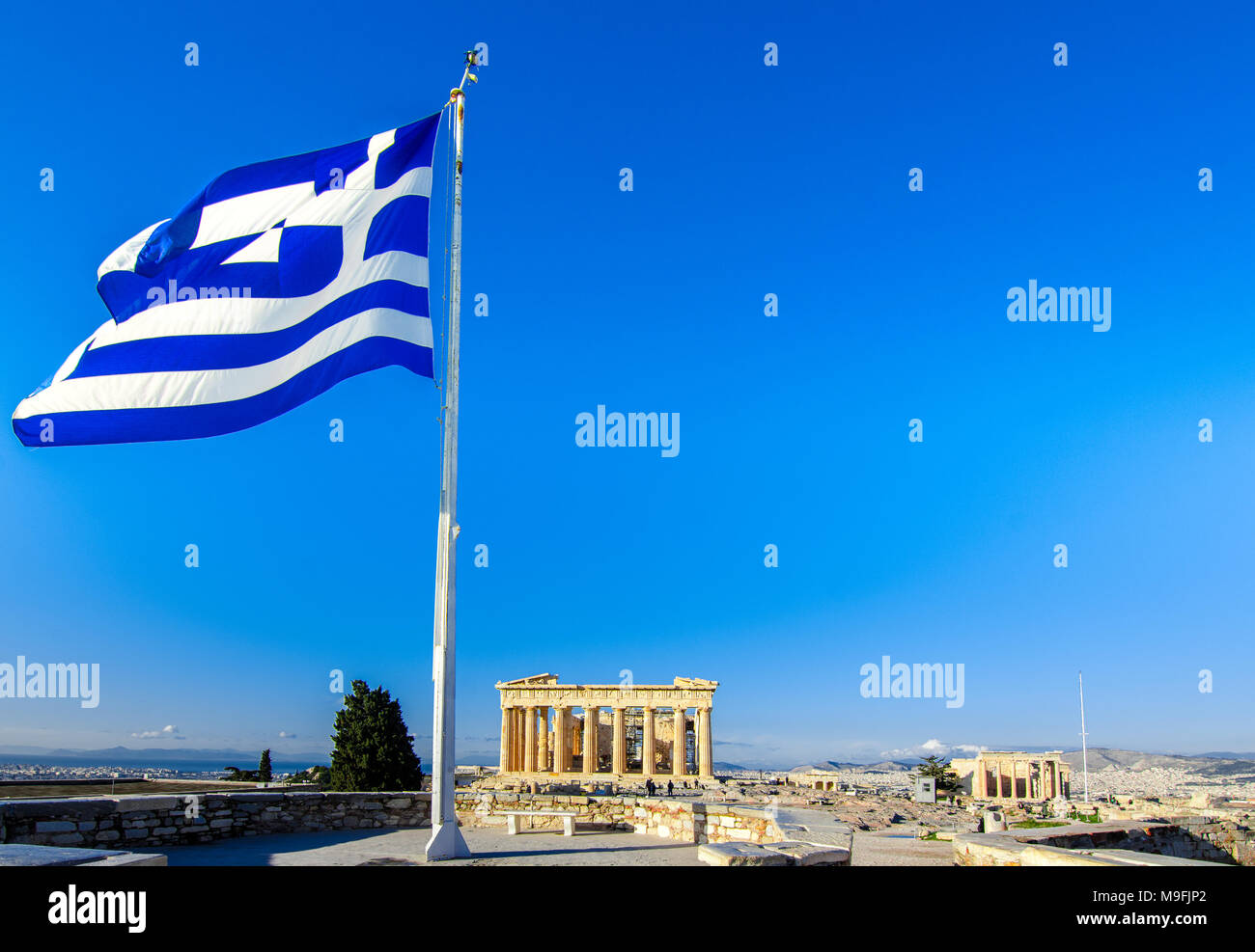 Parthenon temple on the Acropolis in Athens with Greek flag, Greece ...