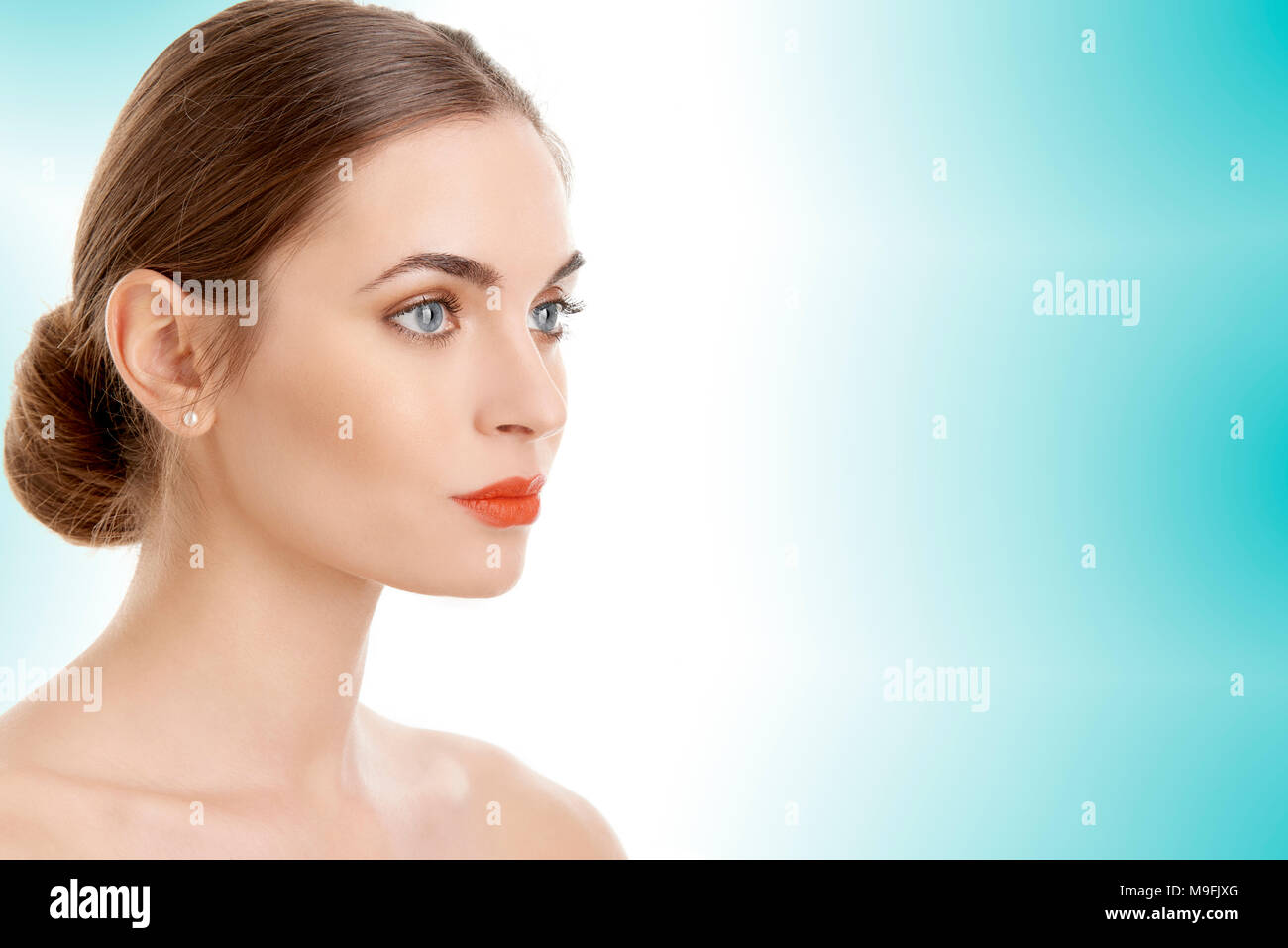 Half-faced profile of a beautiful young woman with perfect skin ...