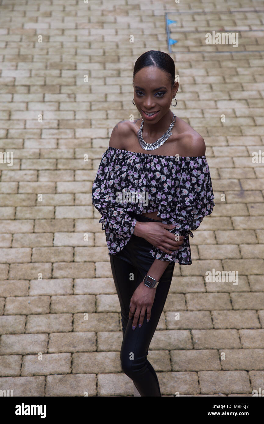 West Indian woman posing clothes Stock Photo - Alamy