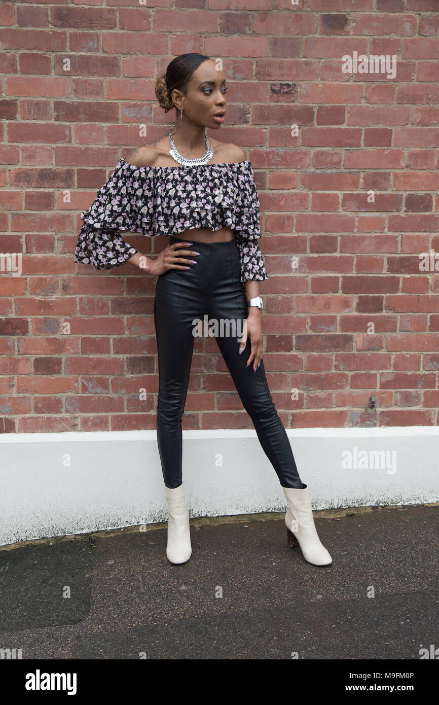 West Indian woman posing clothes Stock Photo - Alamy