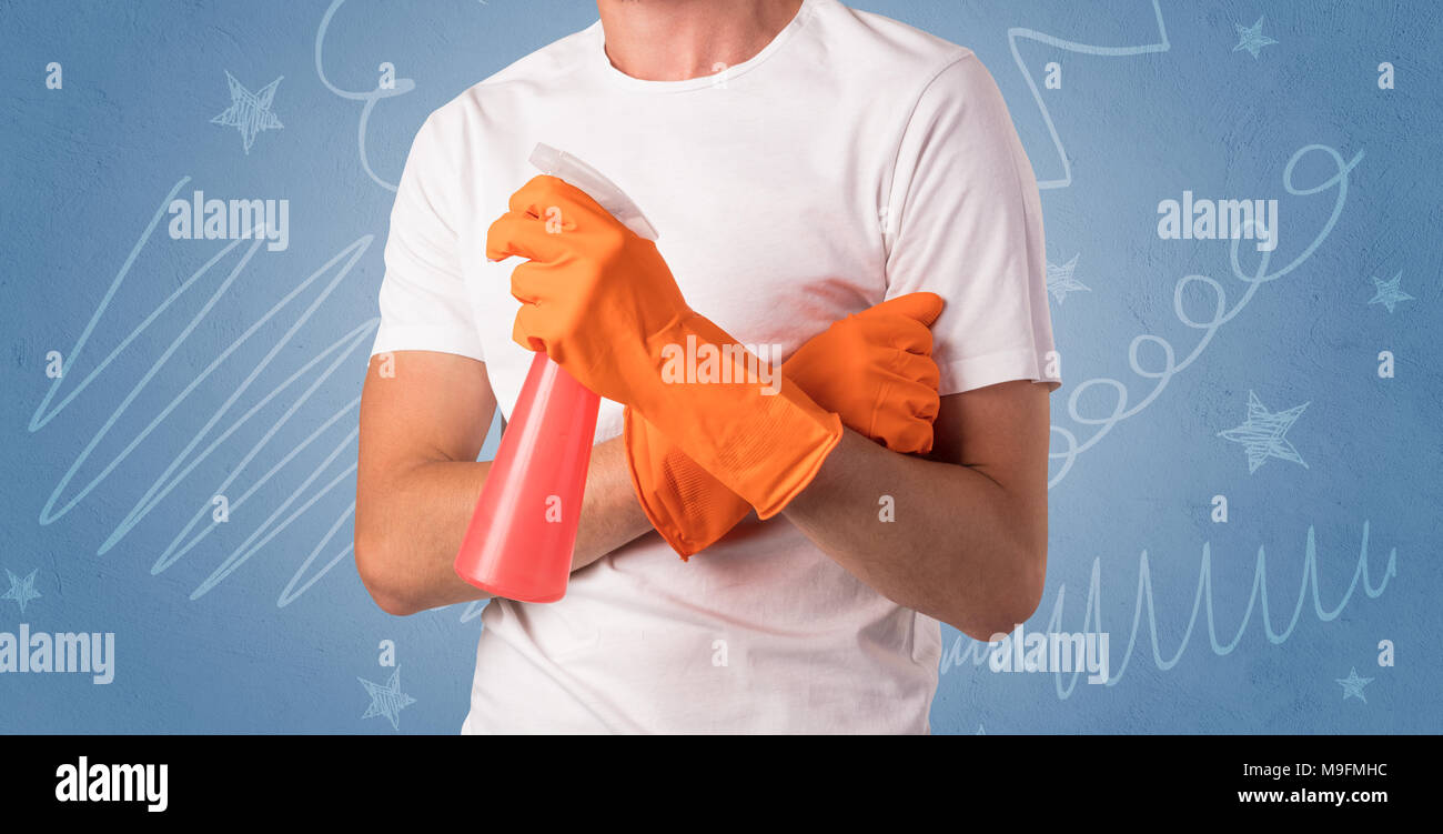 Swabber with orange rubber gloves and doodle concept on wallpaper Stock ...