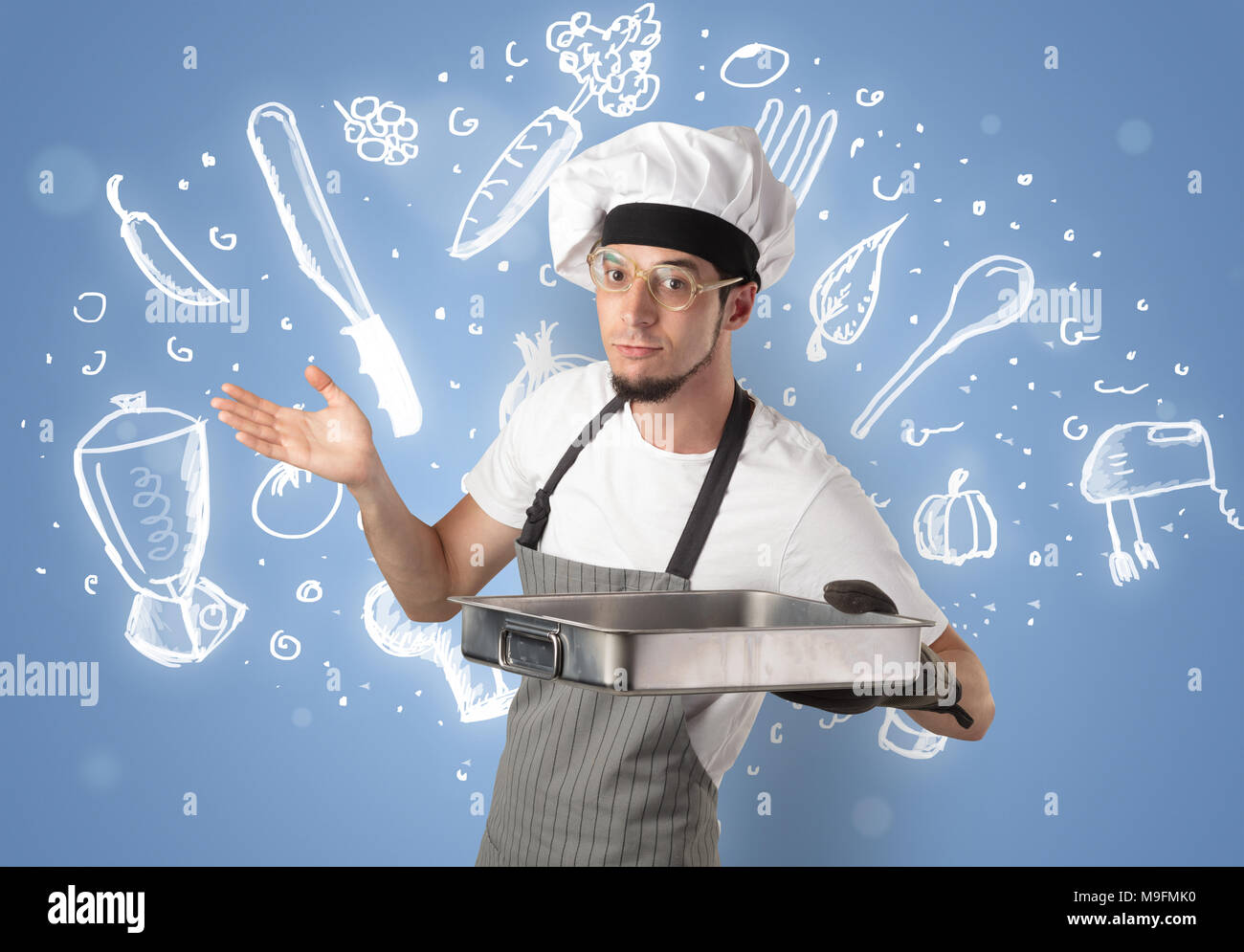 Young cook with kitchen instruments and drawn recipe concept on ...