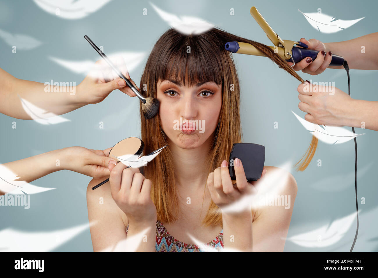 Pretty brunette woman at salon with plume around and ethereal concept ...