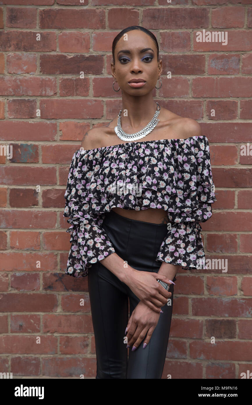 West Indian woman posing clothes Stock Photo - Alamy