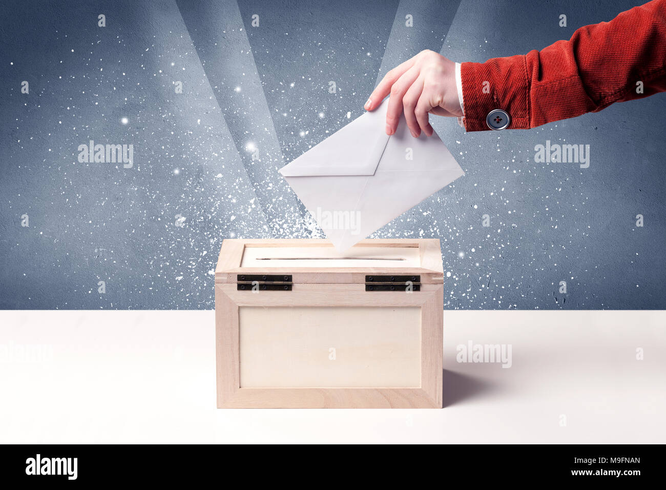 Ballot box with person casting vote on sparkling background Stock Photo ...