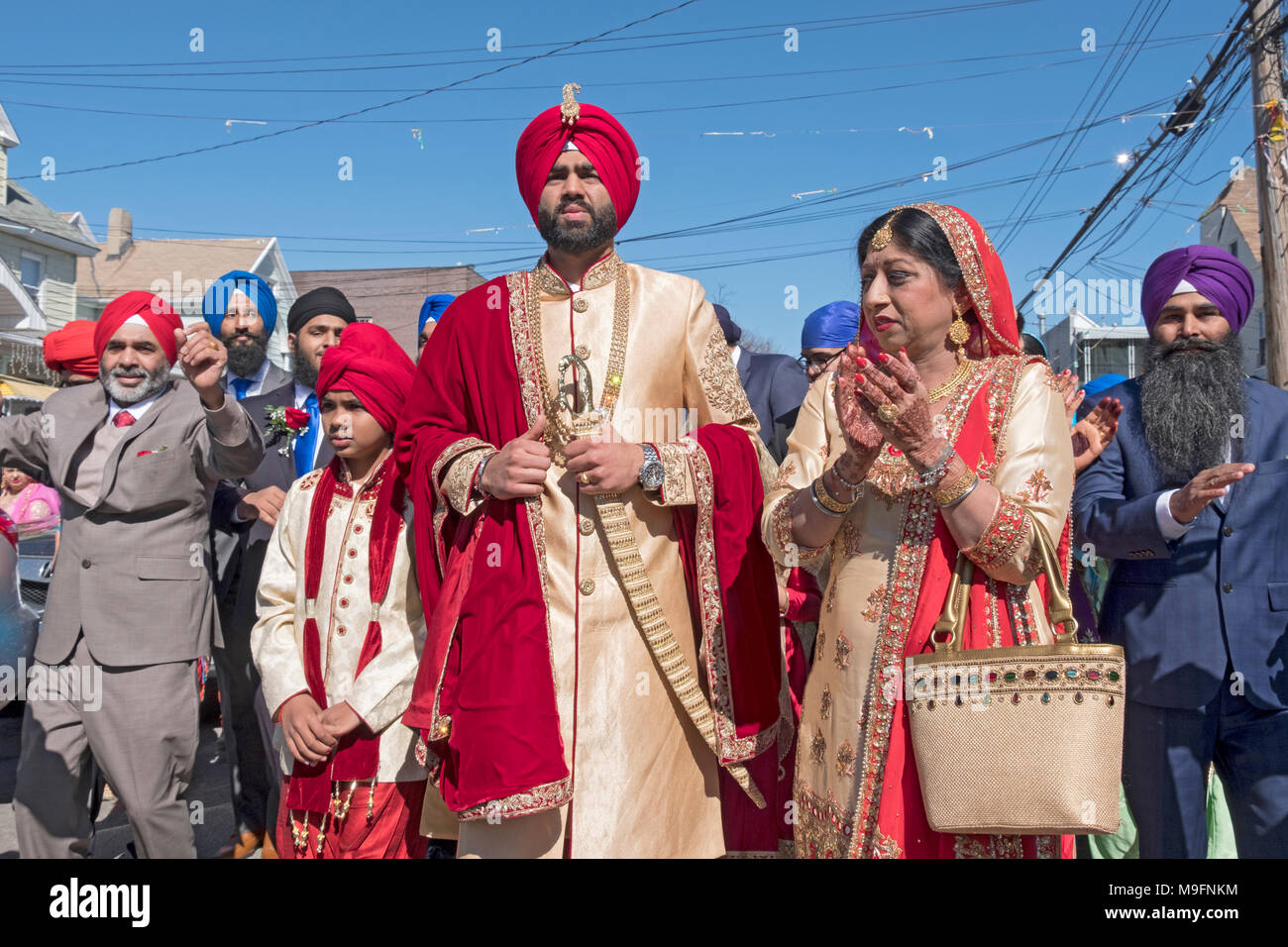 A Sikh groom accompanied by his family & friends, on the traditional ...