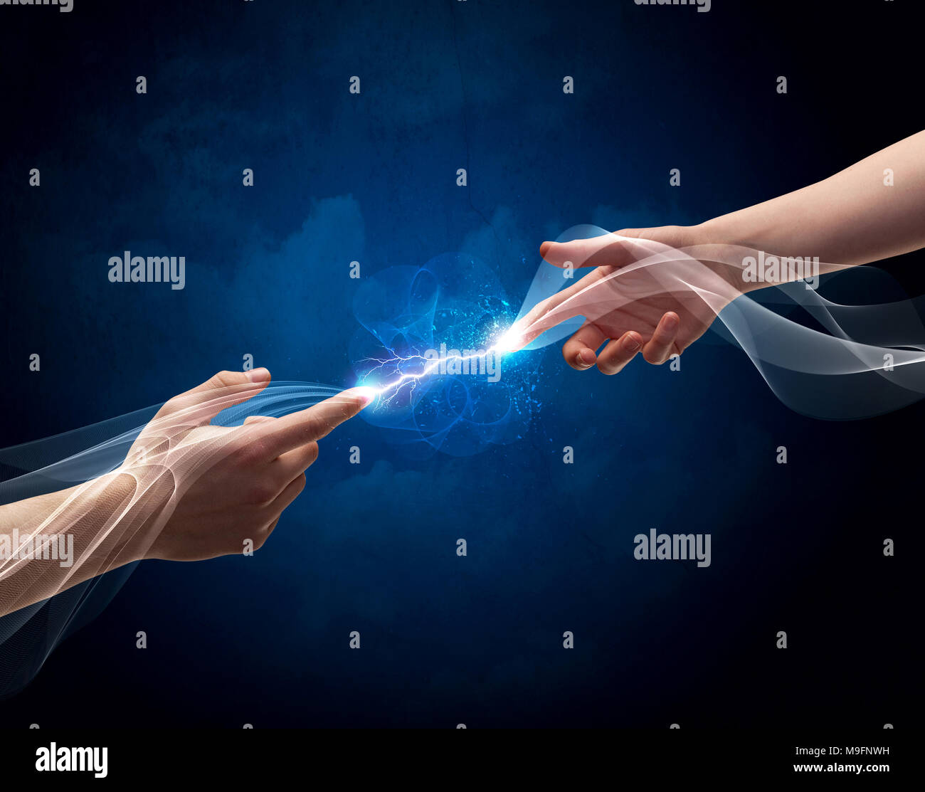Two male arms reaching for each other, with a smoking electric current ...