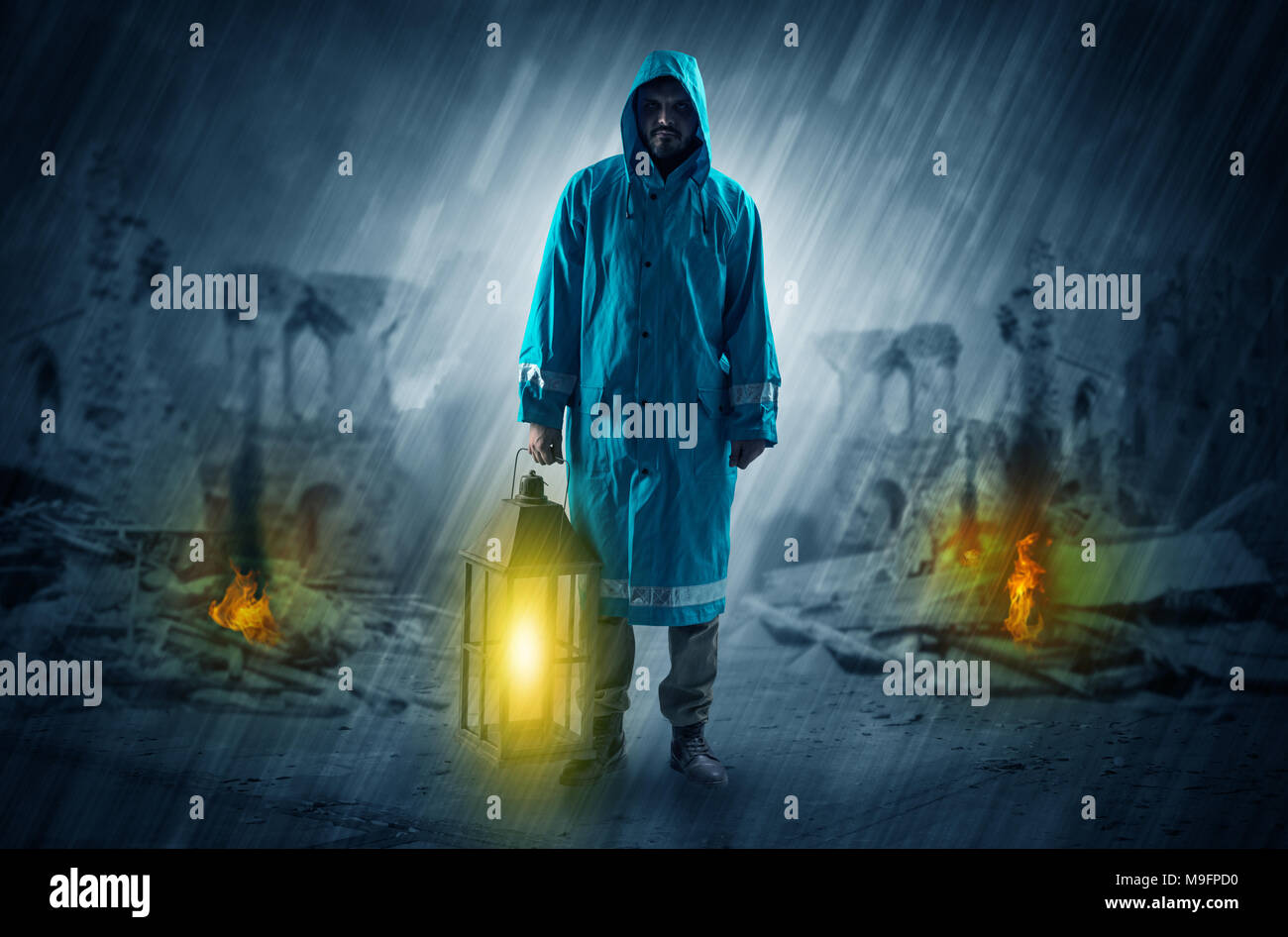 Destroyed place after a catastrophe with man in raincoat and lantern ...