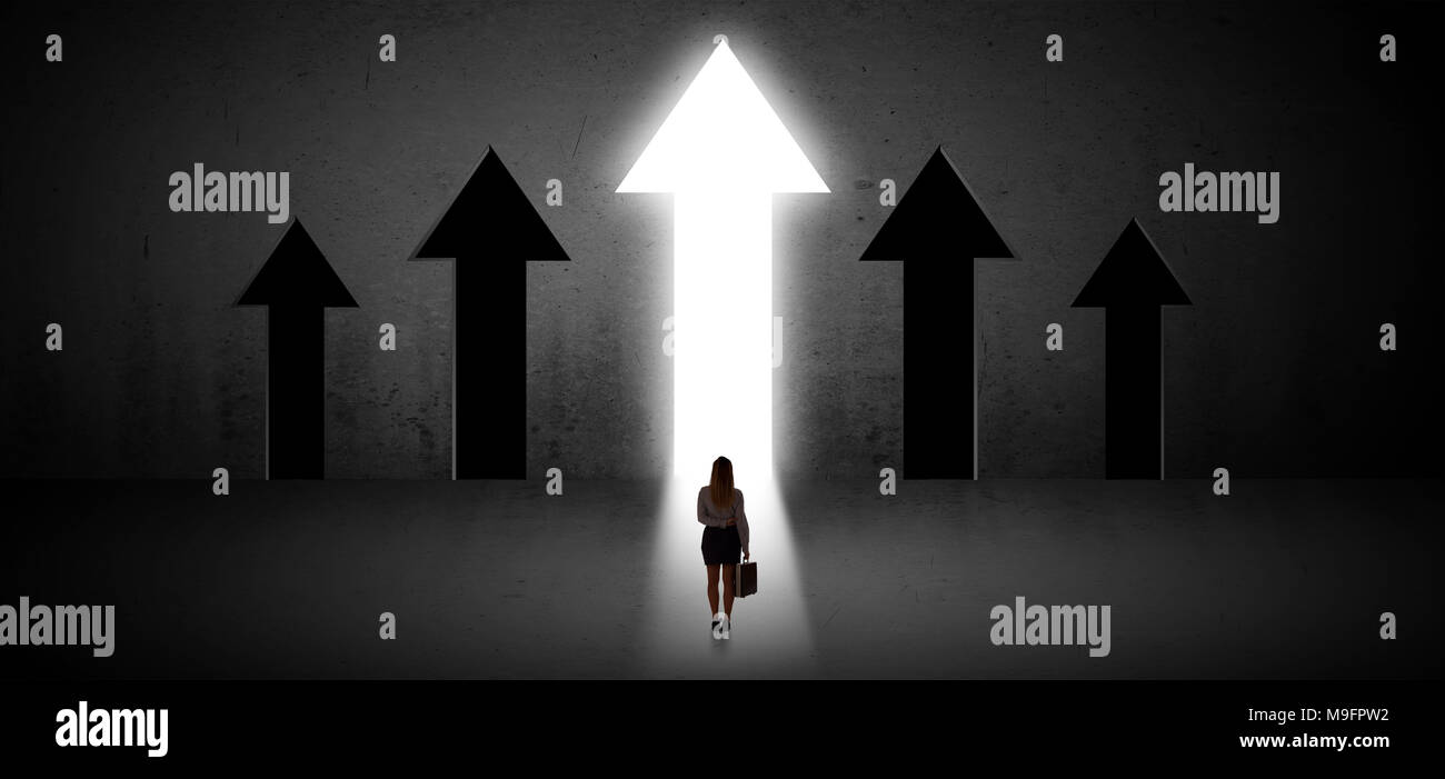 Young woman with back choosing the best way Stock Photo - Alamy