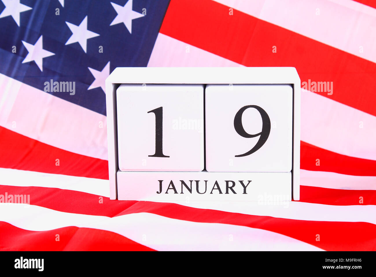 Wooden calendar with the date of January 19 on the American flag ...