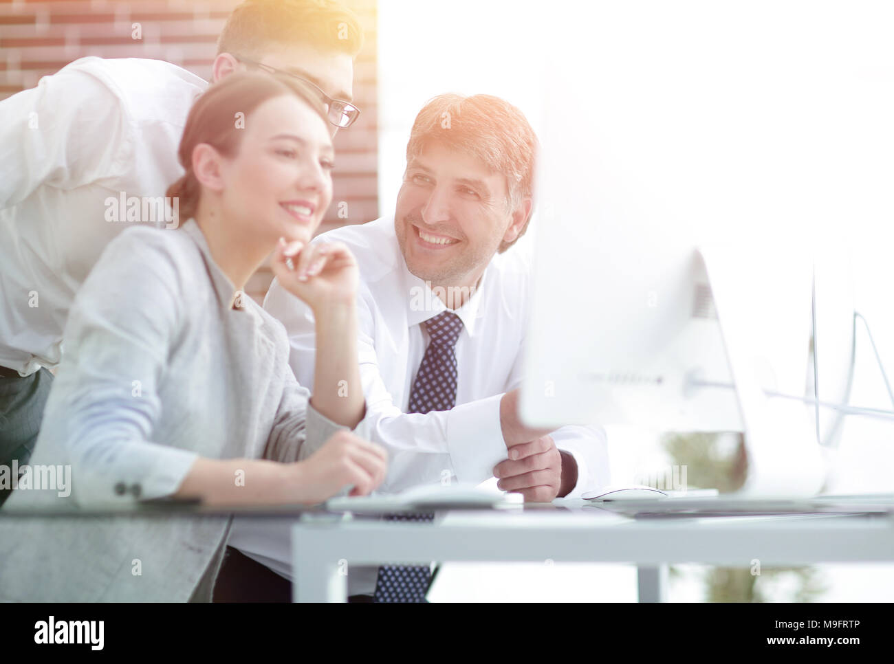 Business team sitting at the desk. Teamwork Stock Photo - Alamy