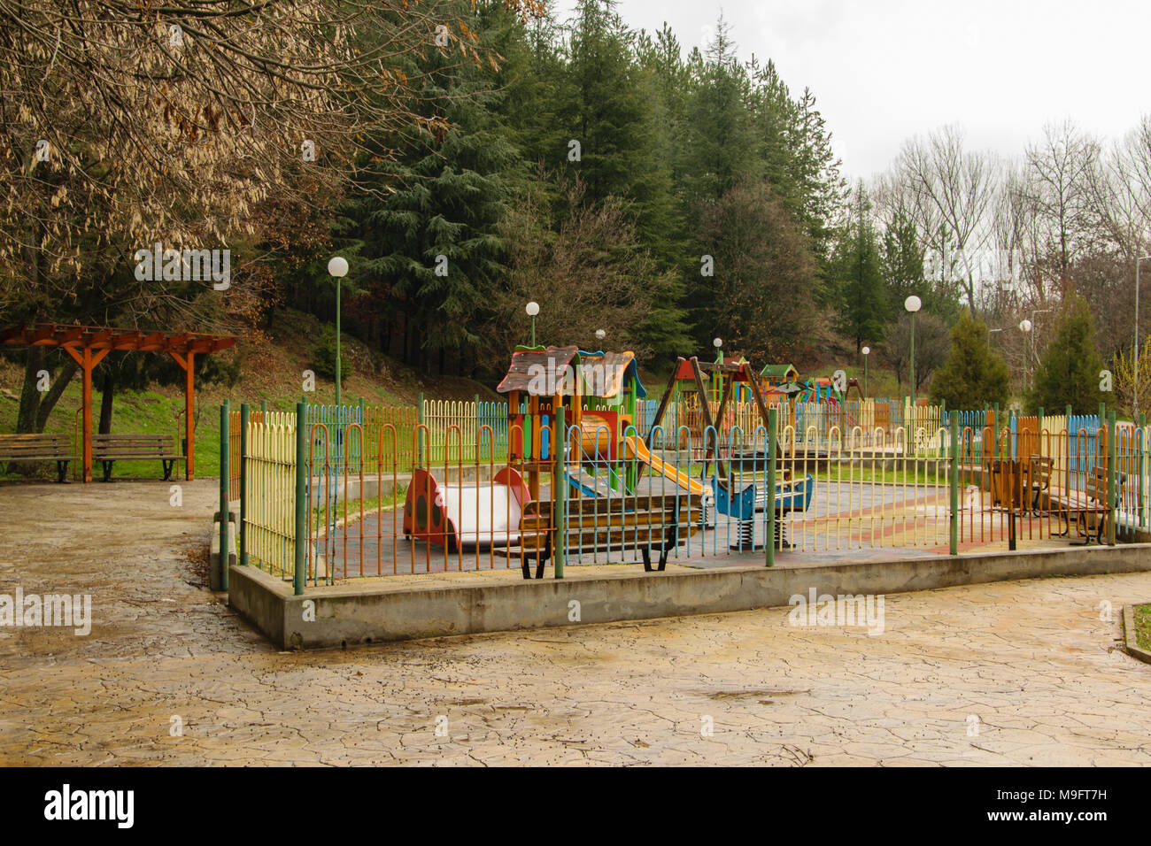 Colorful children playground in the green area Stock Photo - Alamy
