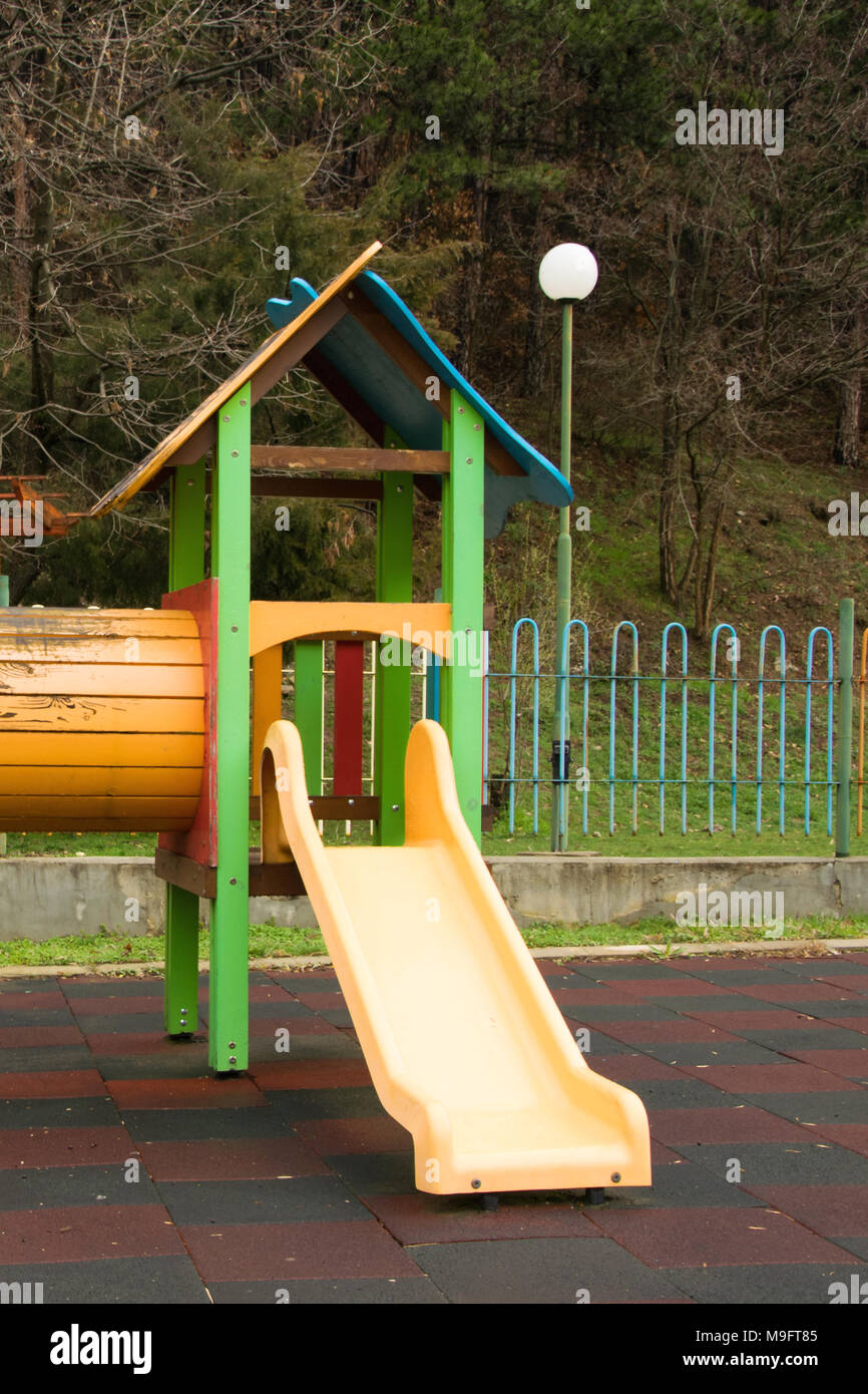 Colorful children playground in the green area Stock Photo - Alamy