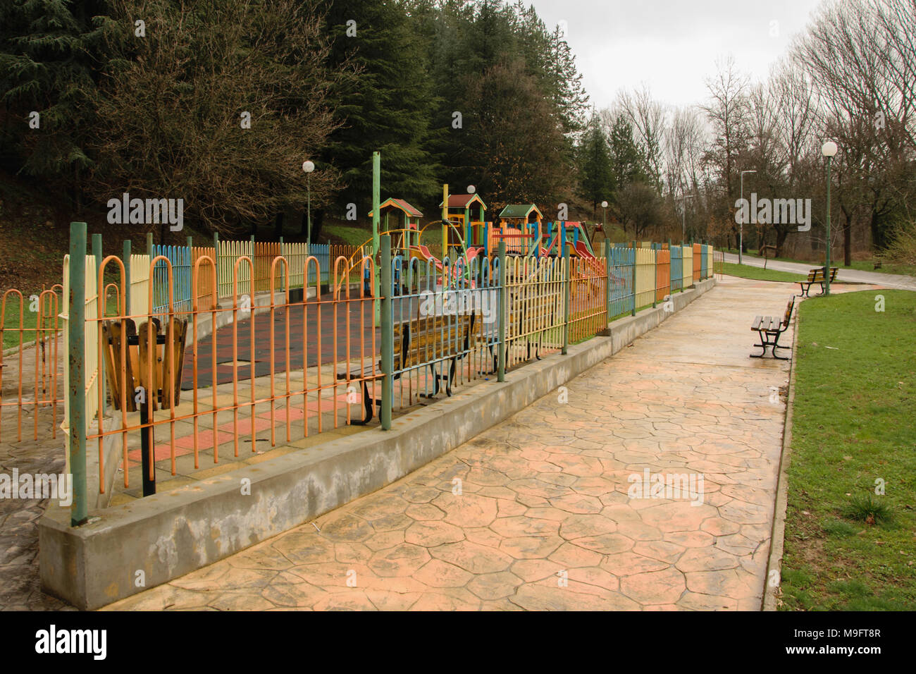 Colorful children playground in the green area Stock Photo - Alamy