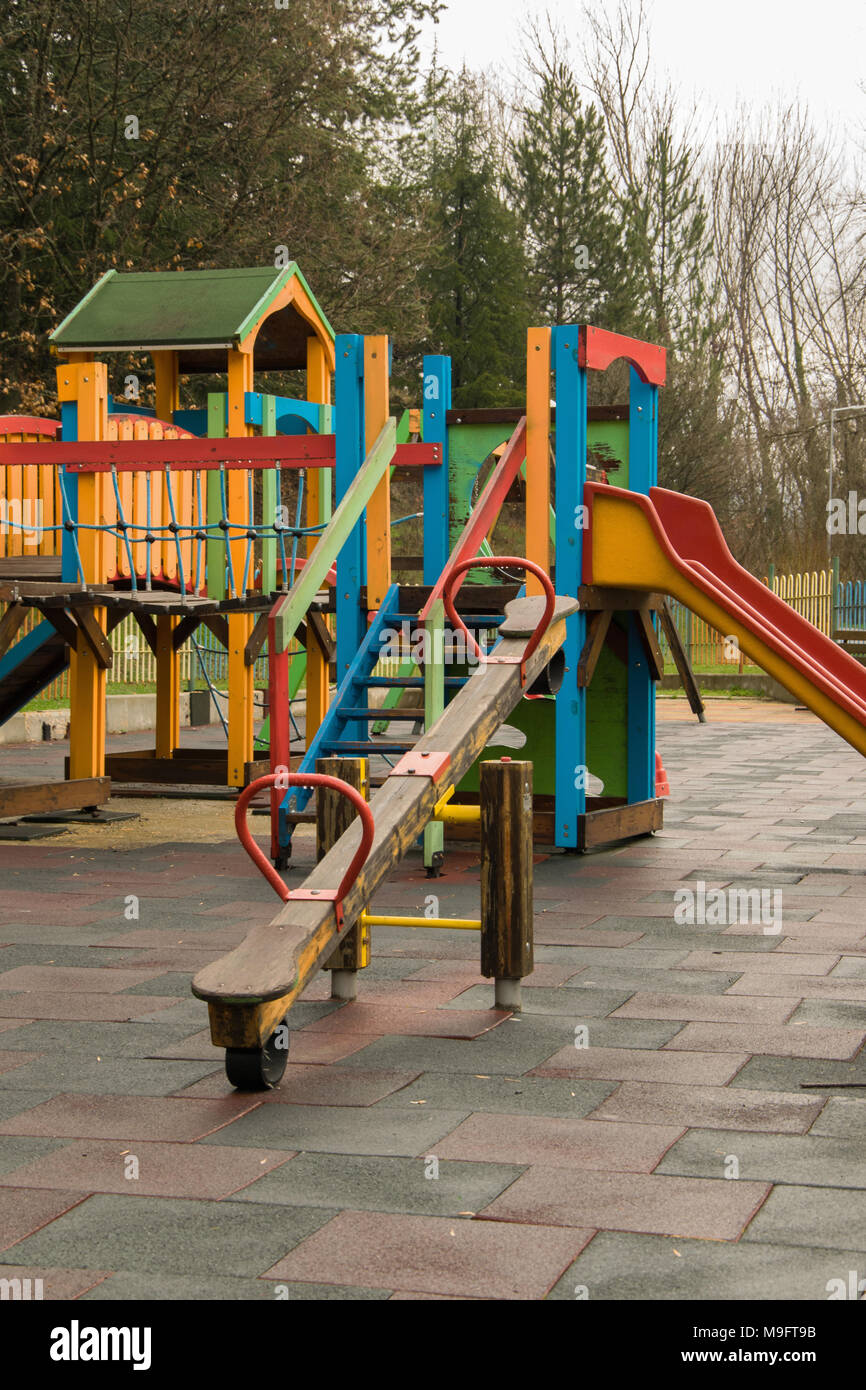 Colorful children playground in the green area Stock Photo - Alamy