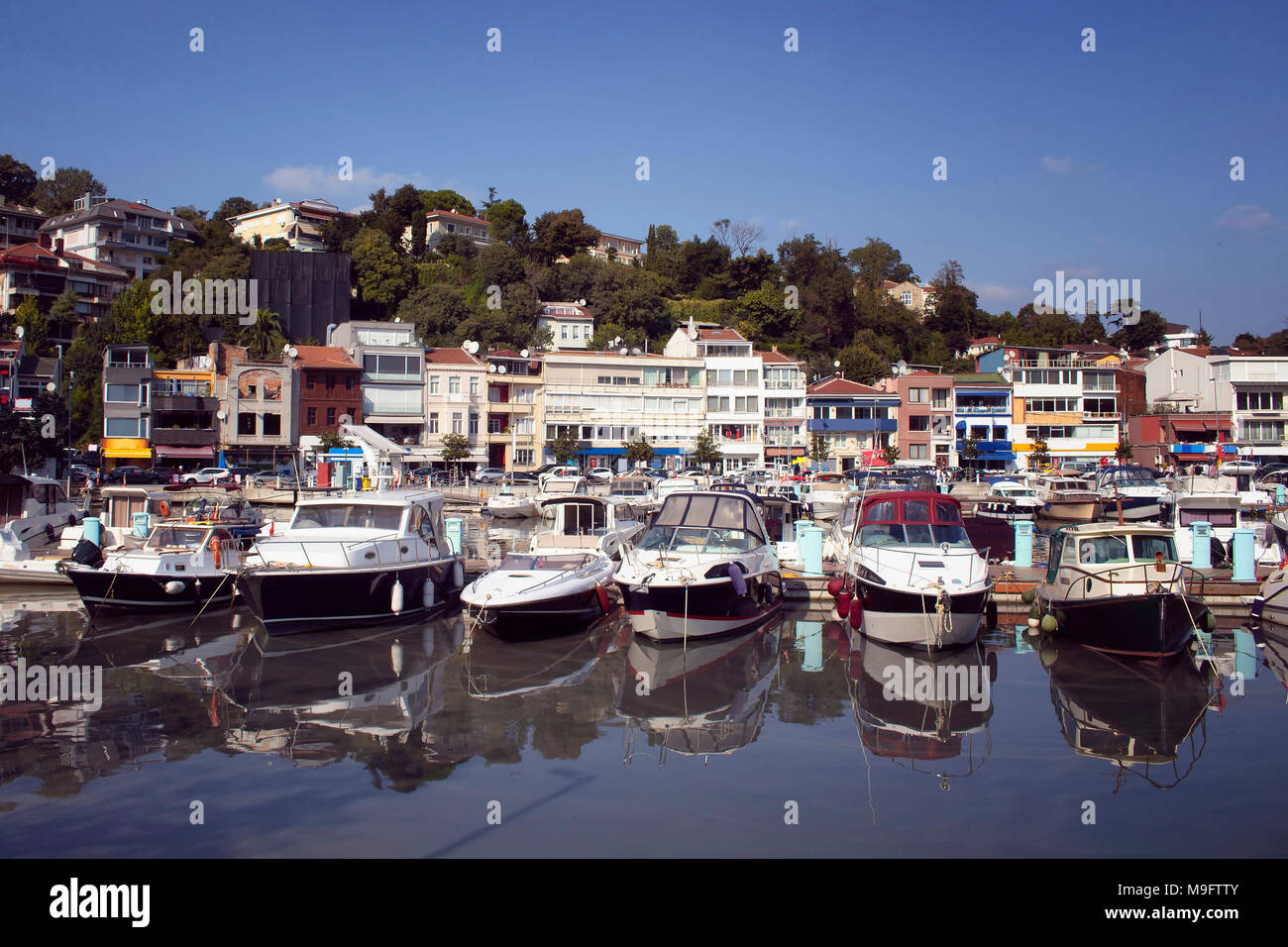 View of boats and yachts at Tarabya marina with buildings in the ...
