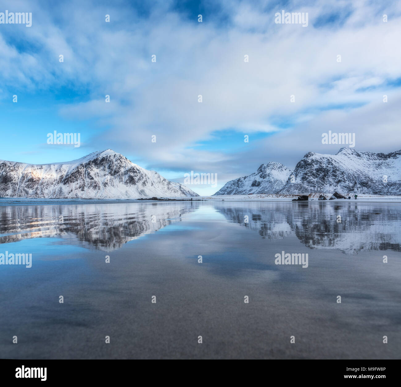 Sandy beach with beautiful reflection in water, Lofoten islands, Norway ...