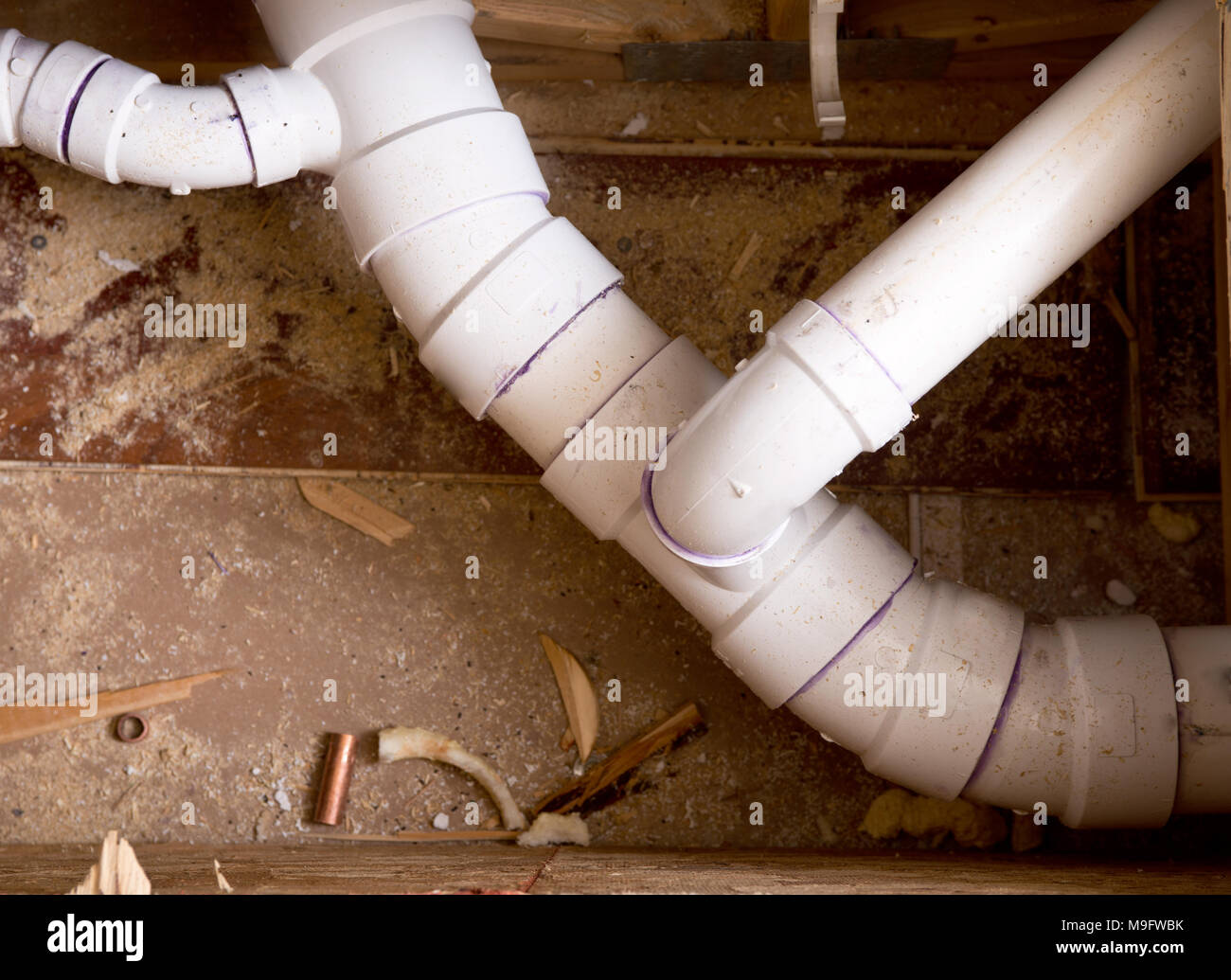 House drain, sewer pipes in the bathroom of house under remodeling ...